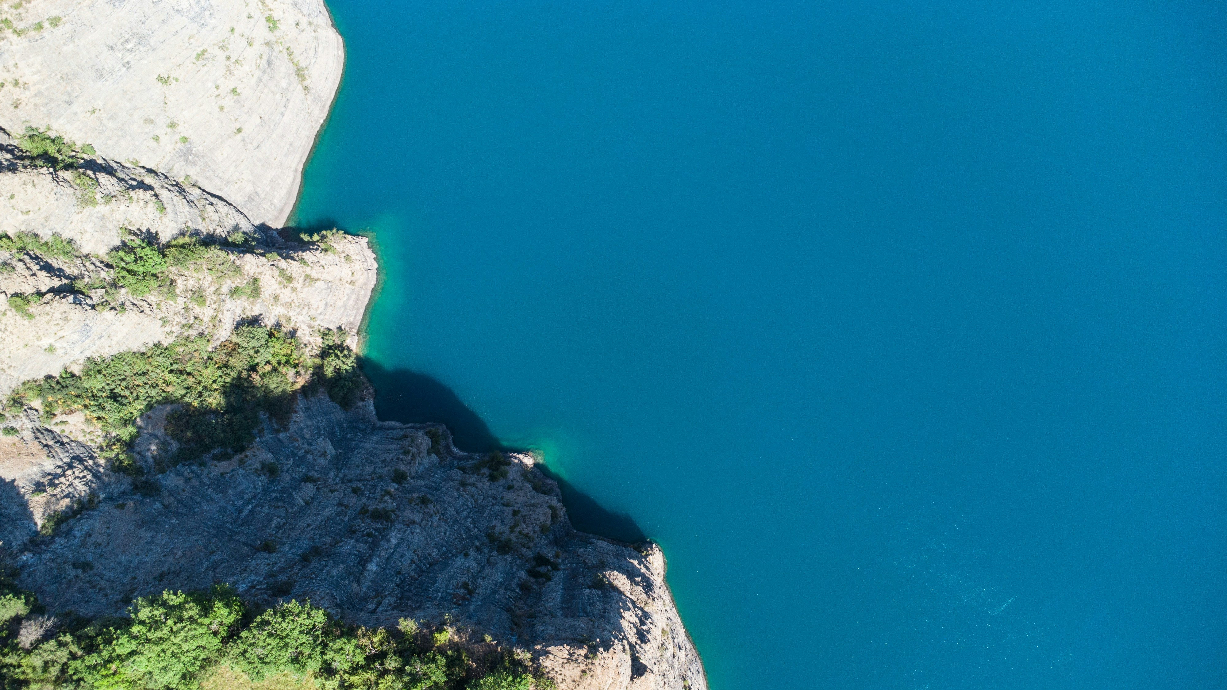 Aerial Cliff Edge Over Turquoise Waters