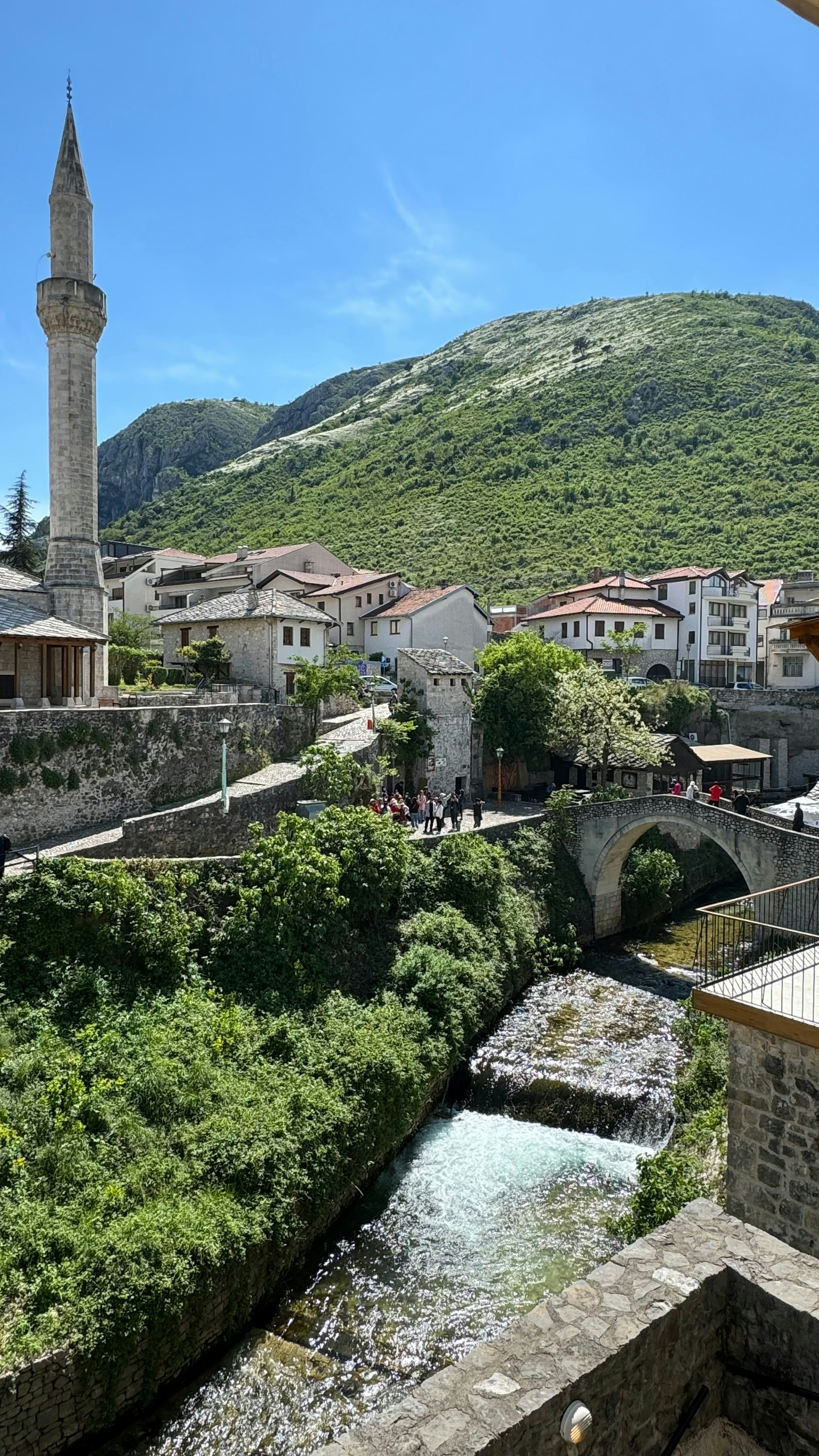 Stone-Bridge Serenade: Minaret Over a Mountain Village by the River