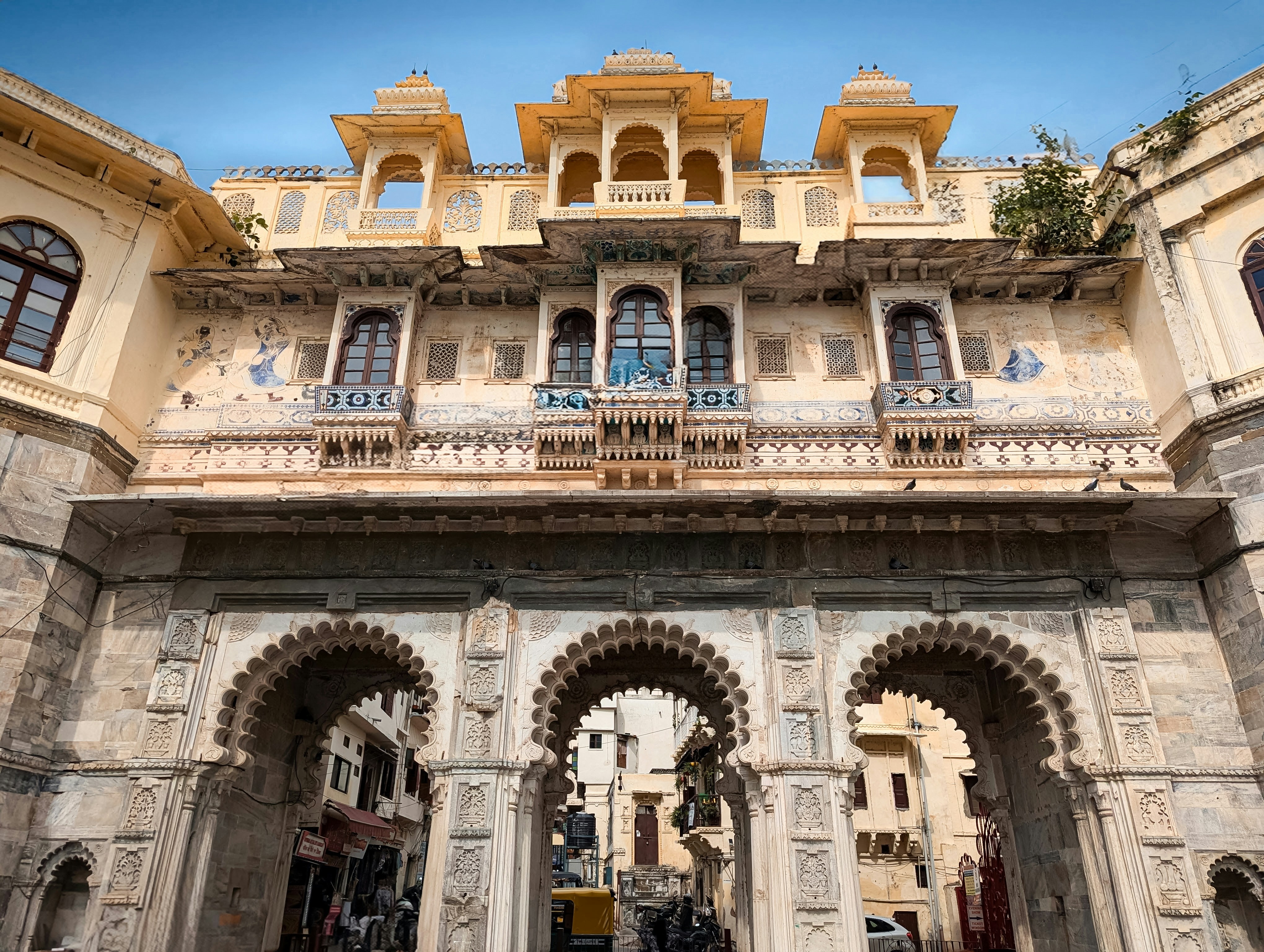 A large stone building with arches and windows photo – Free Gangaur ...