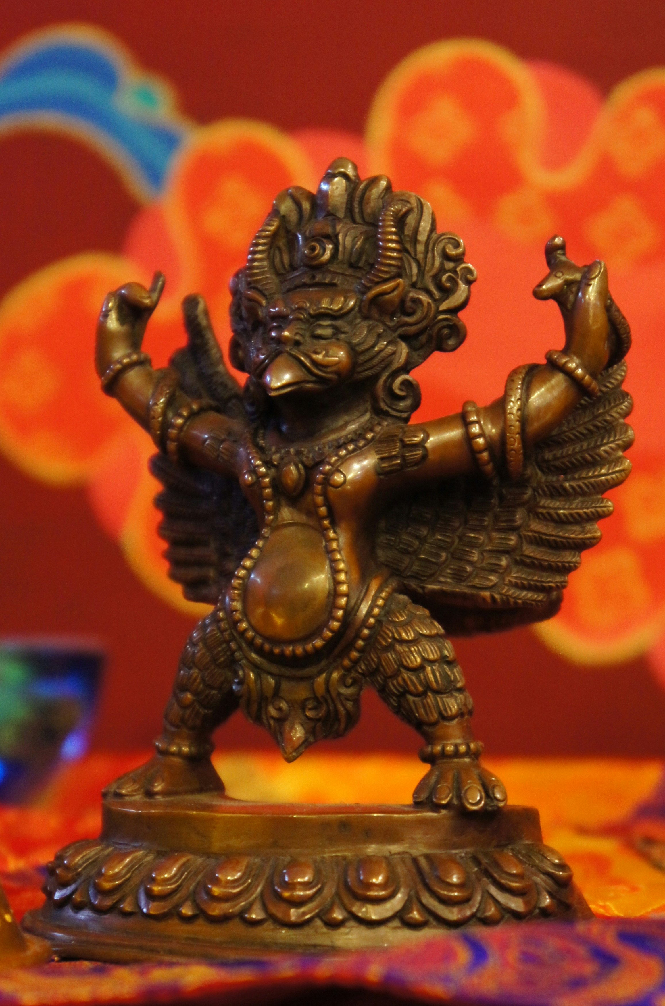 A statue of a mythical creature on a table photo – Free Sculpture Image ...