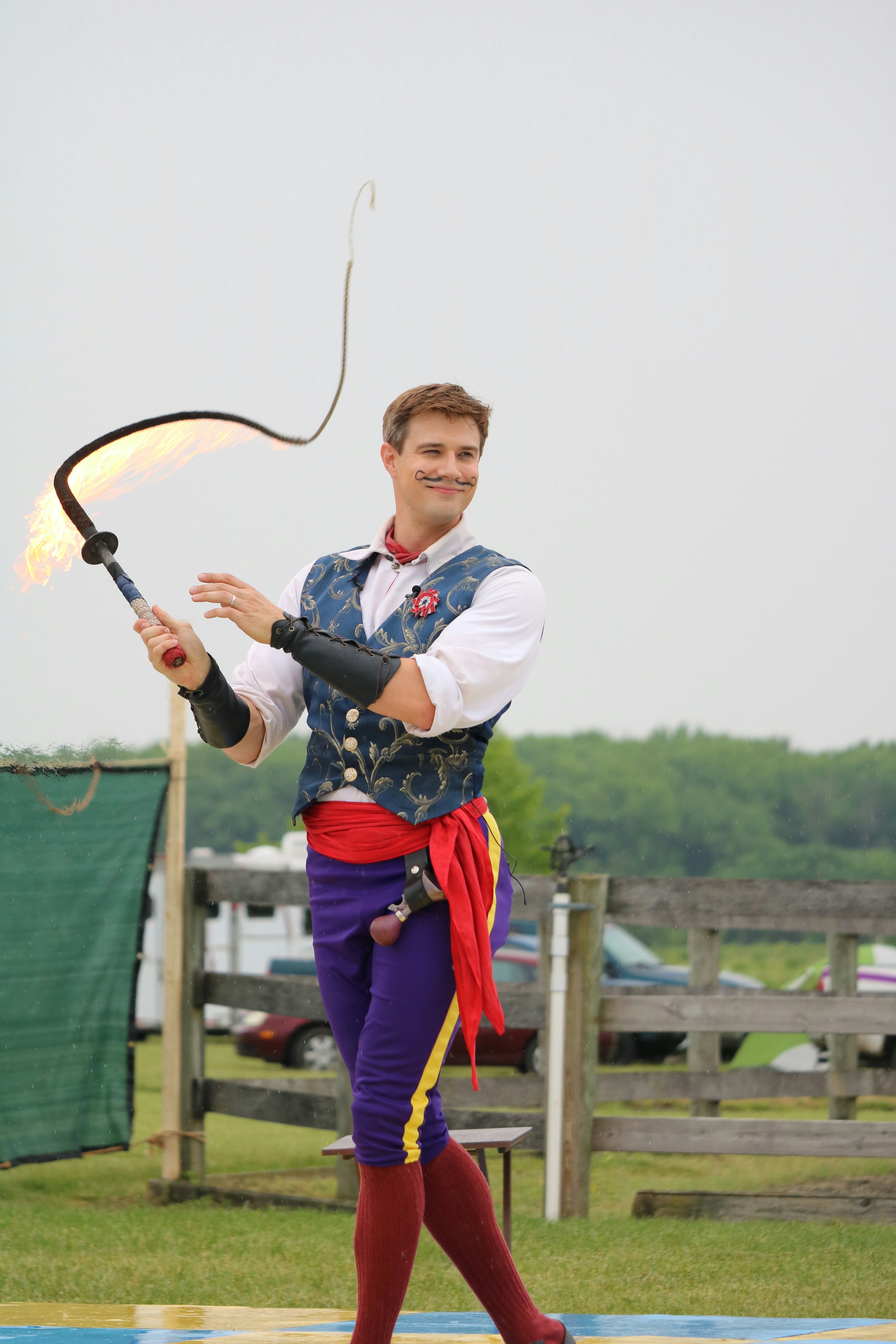 Daylight Fire Act: Victorian-Style Performer Wields Flaming Torch