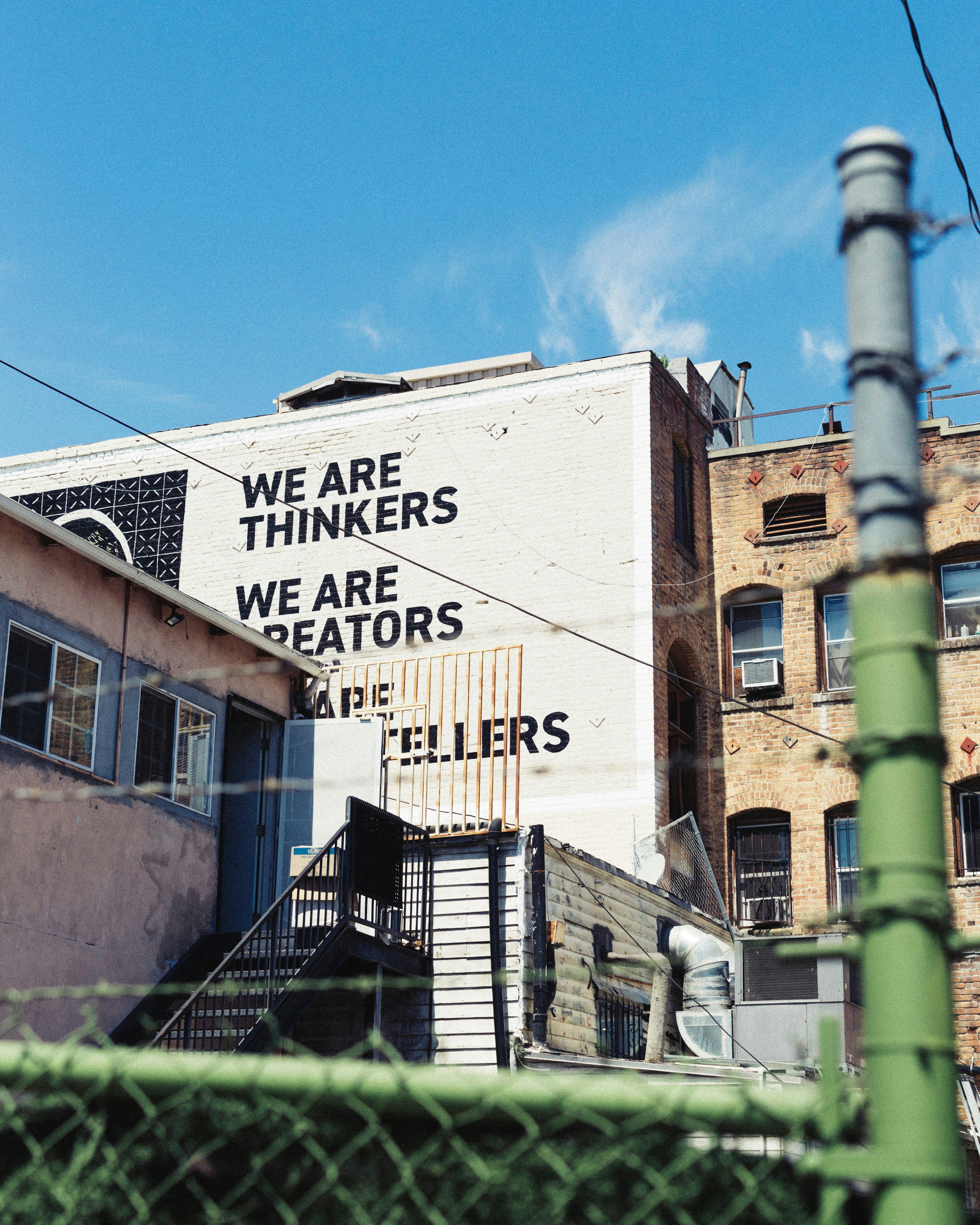 A building with a sign that says we are thinkers photo – Free ...