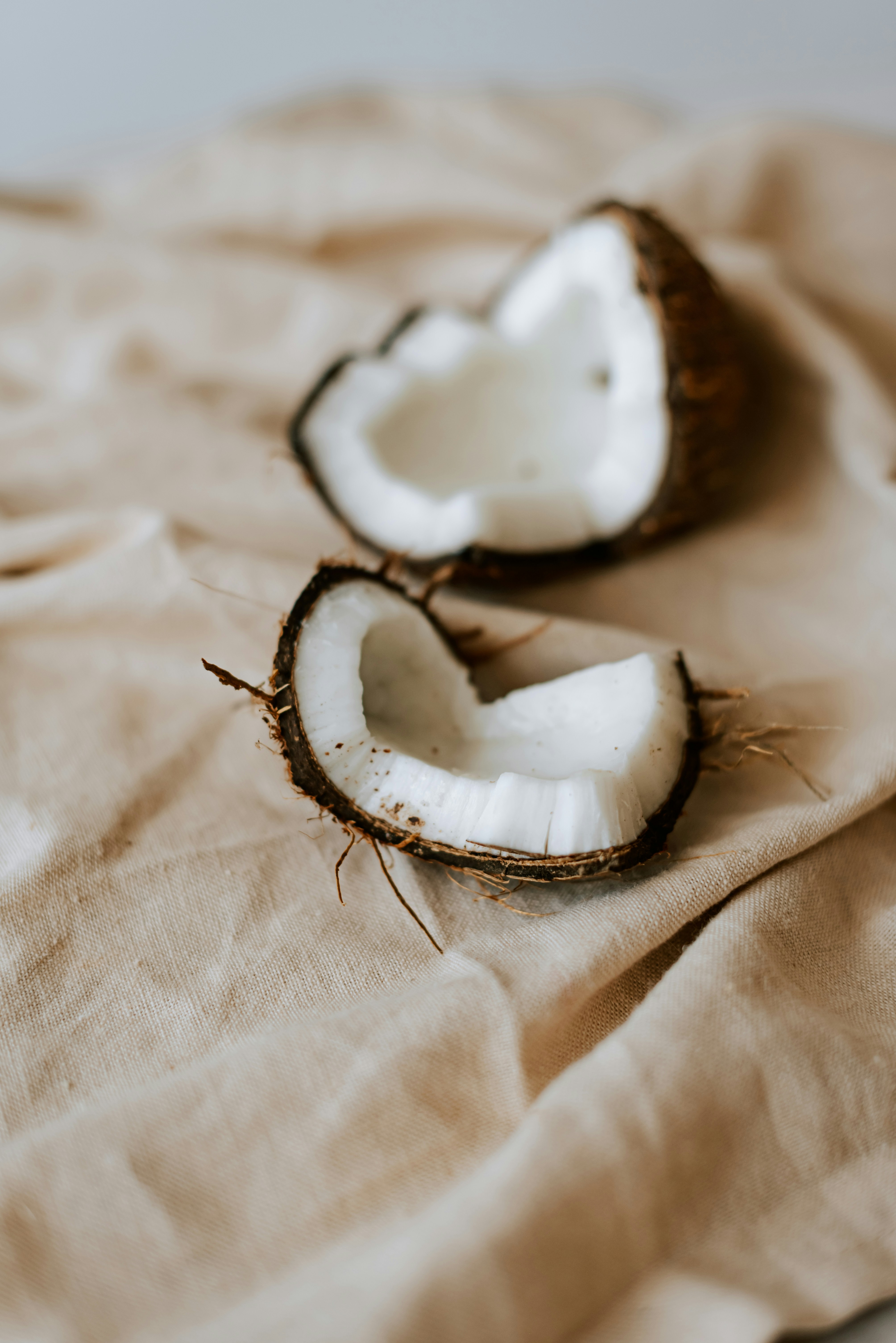 Soft-Light Coconut Halves on Linen: A Quiet Still-Life Study