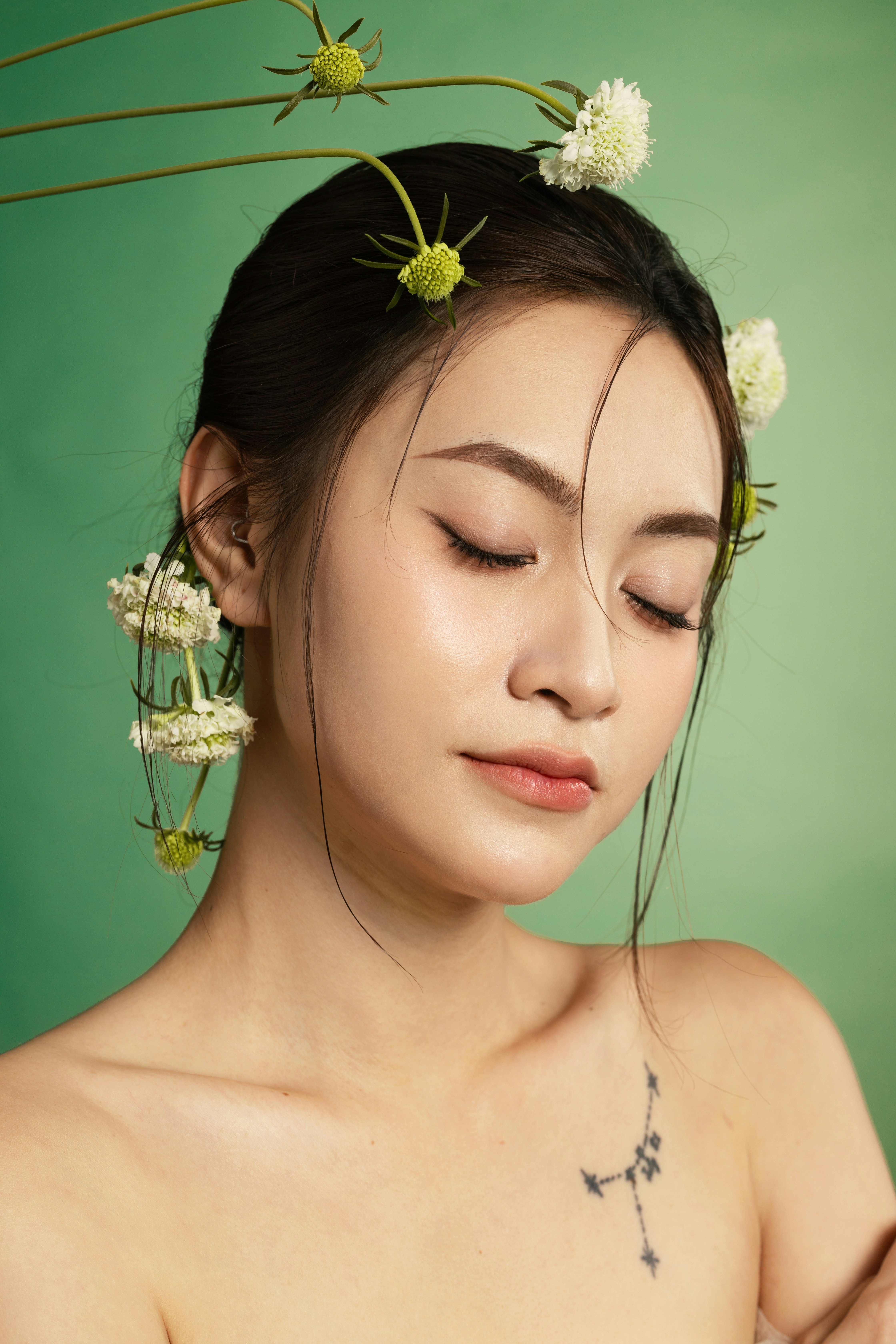 Floral Halo Portrait: Quiet Confidence Under a Green Backdrop