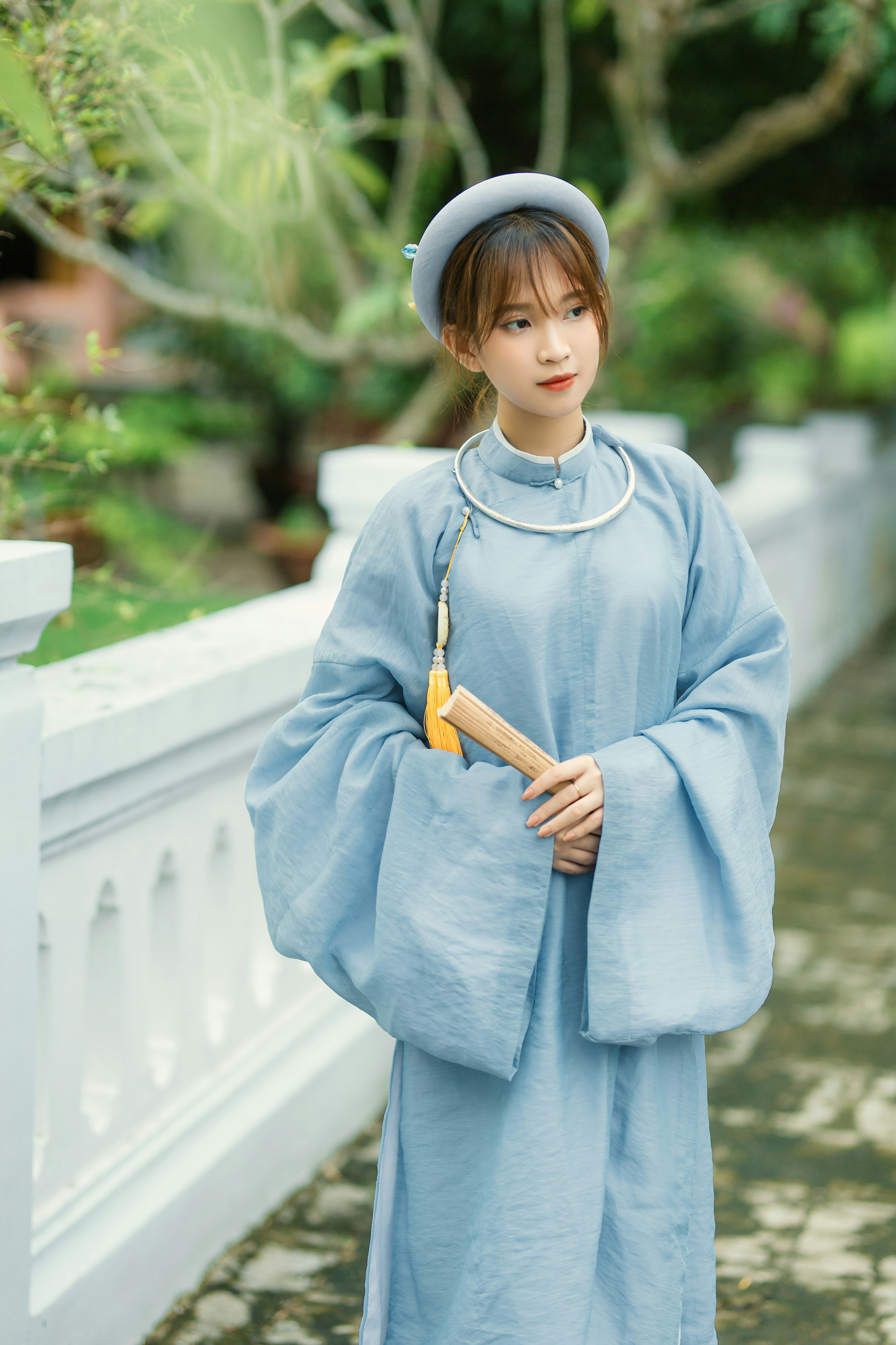 Blue Hanfu by the Water: A Serene Portrait