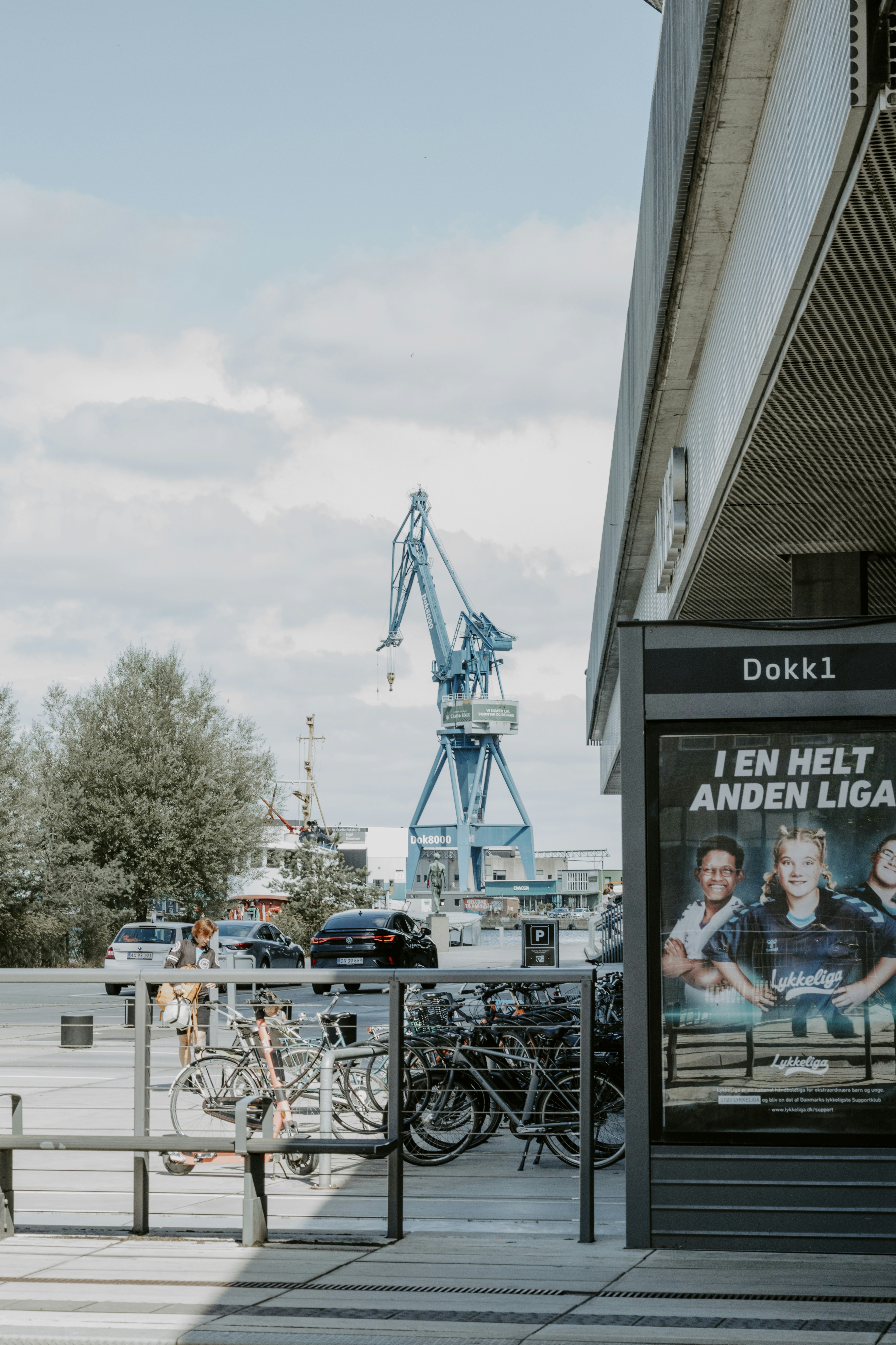 Blue Harbor Crane Over a Quiet Dockside Street