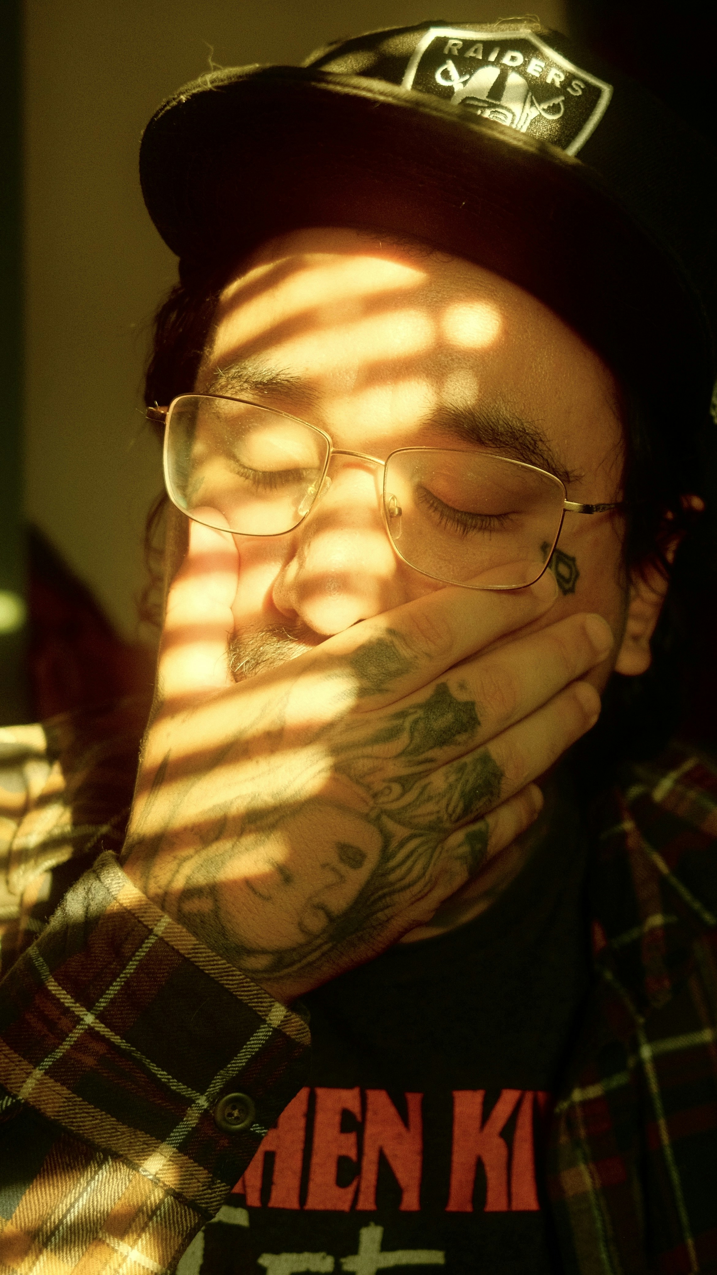 Light-Slashed Portrait: Quiet Moment Under Striped Sun