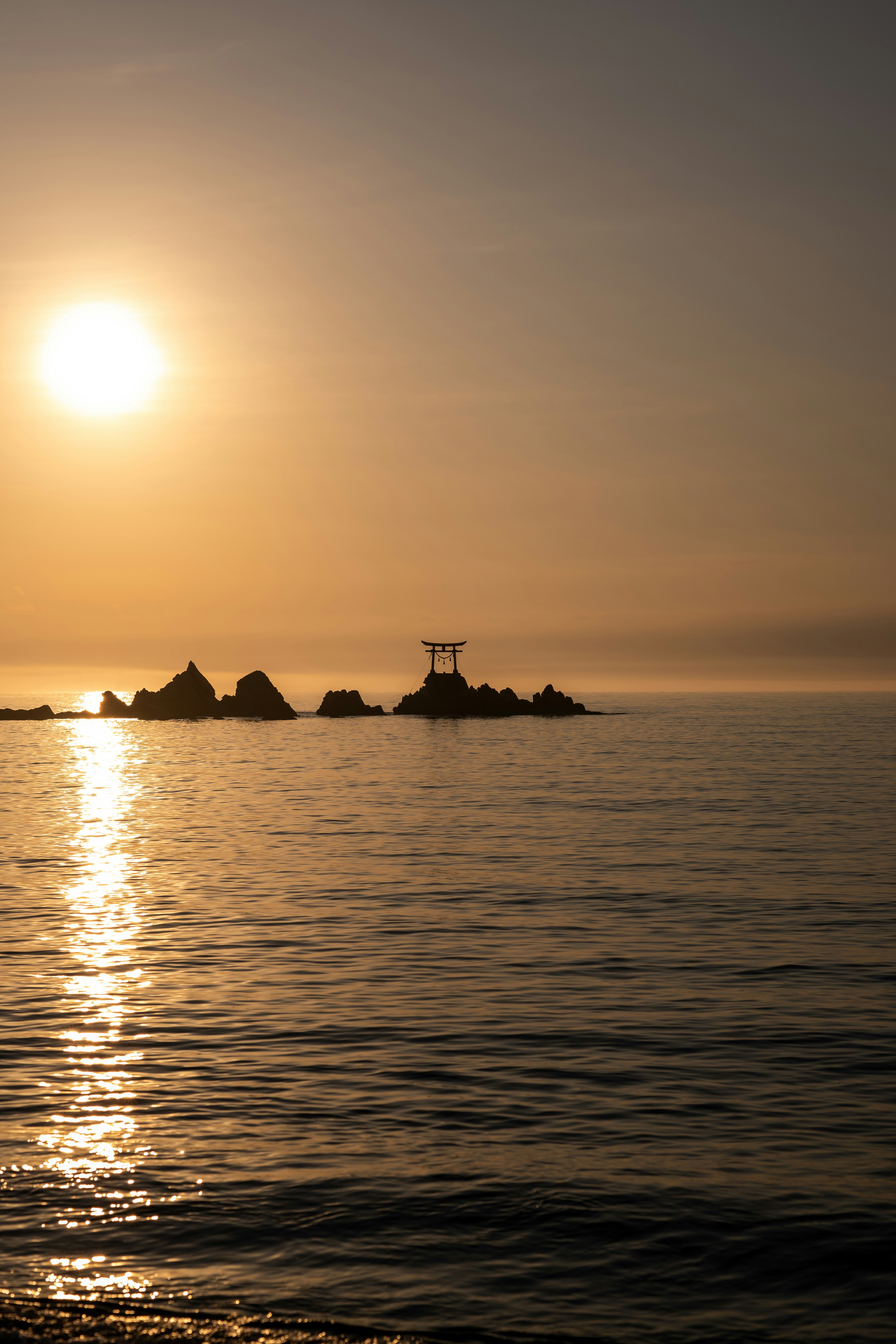 Sunlit Torii on a Quiet Sea: A Golden Horizon