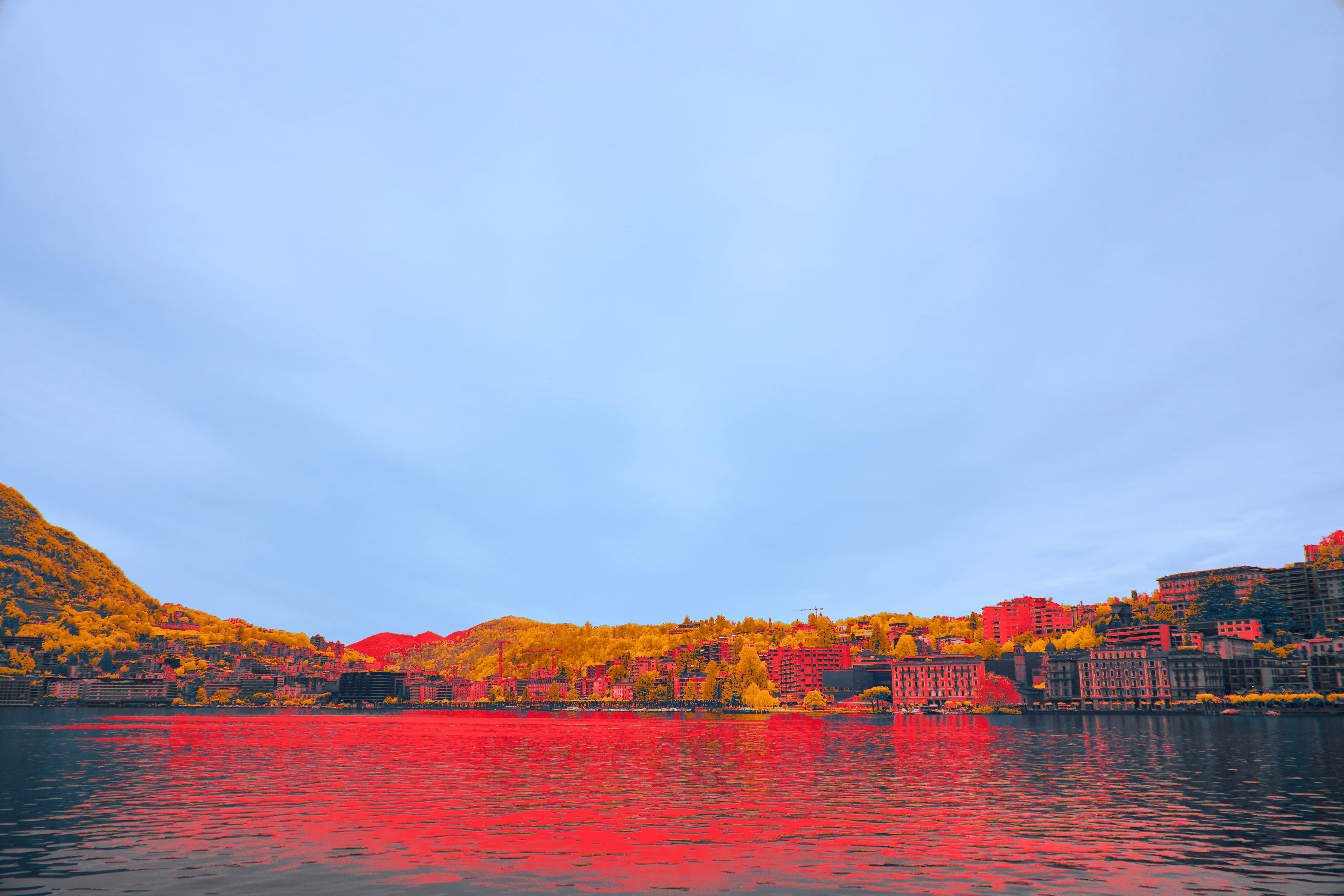 Crimson Reflections Along the Quiet Waterfront City
