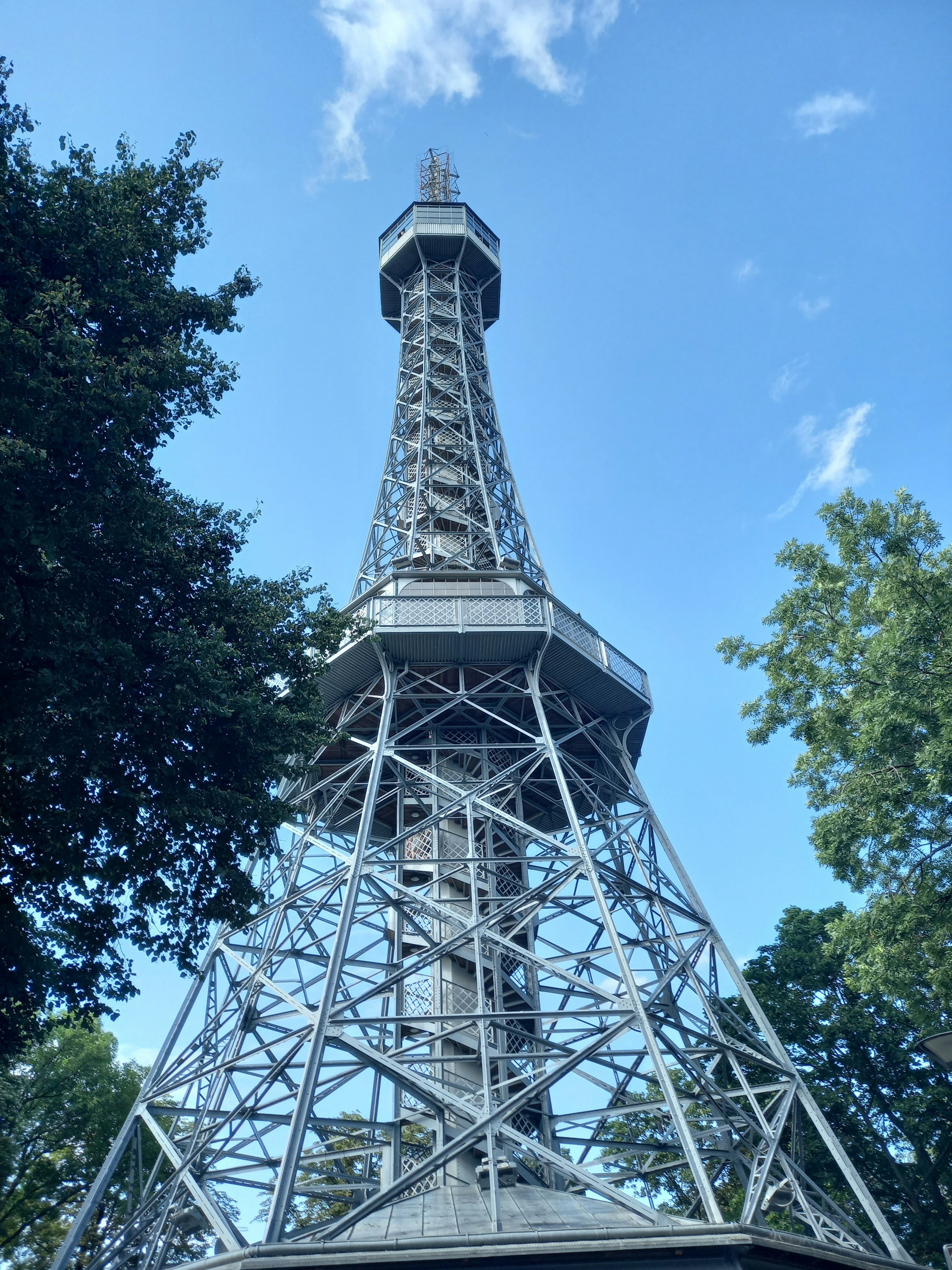 Iron Lattice Sentinel Beneath a Clear Blue Canopy