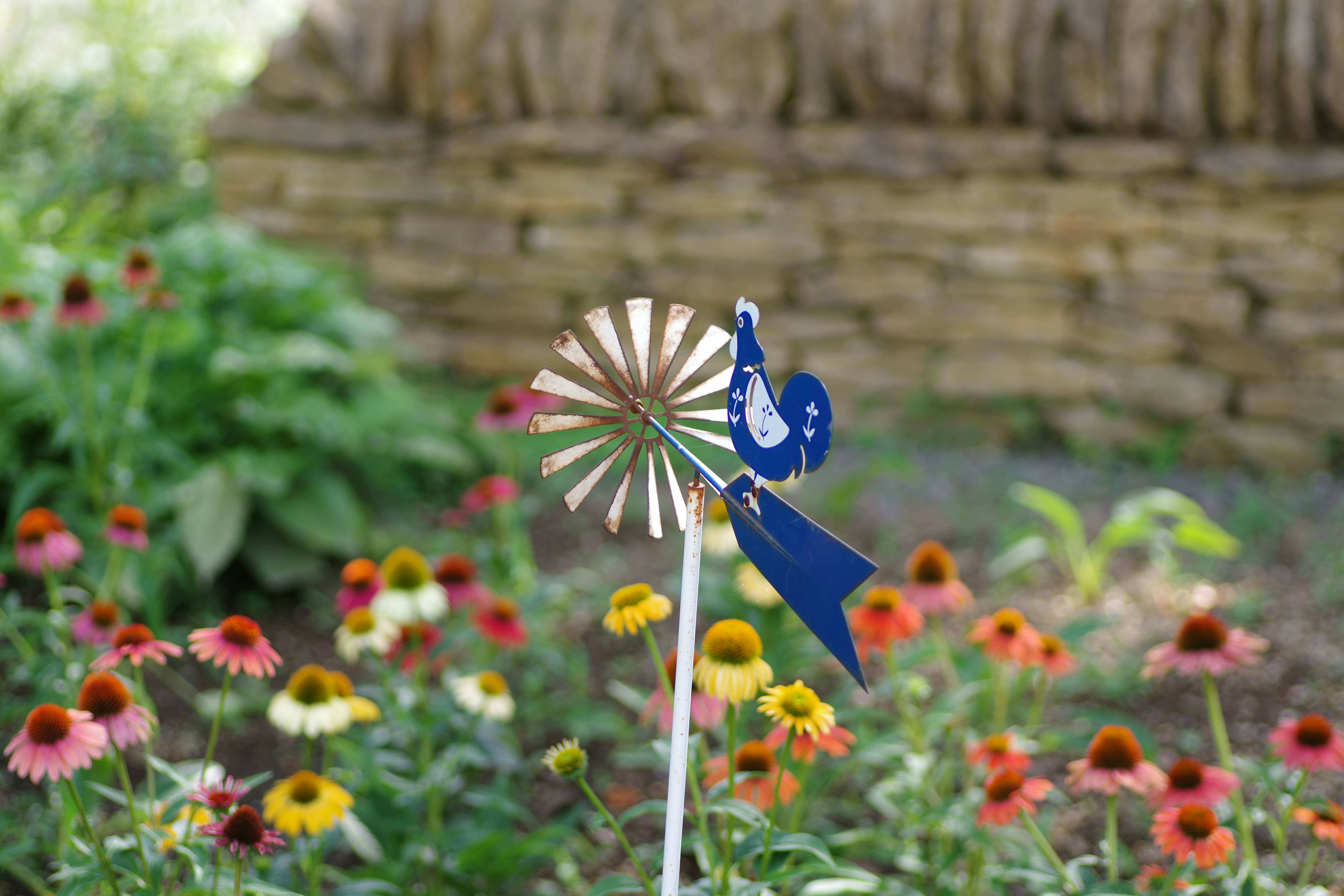 Colorful Garden Windmill: A Quiet Moment Among Summer Blooms