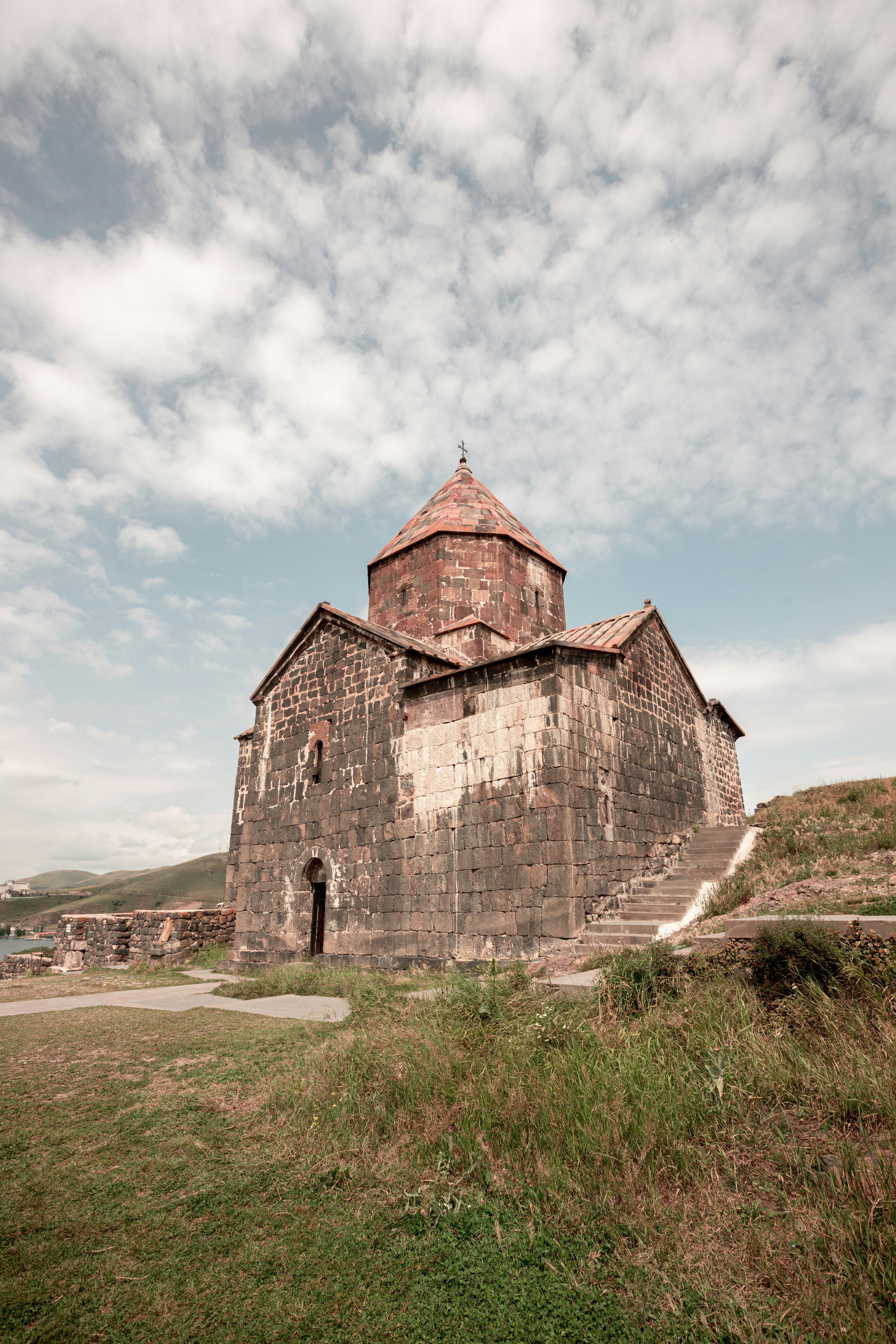 Stone Chapel on a Hill Beneath a Quilt of Clouds