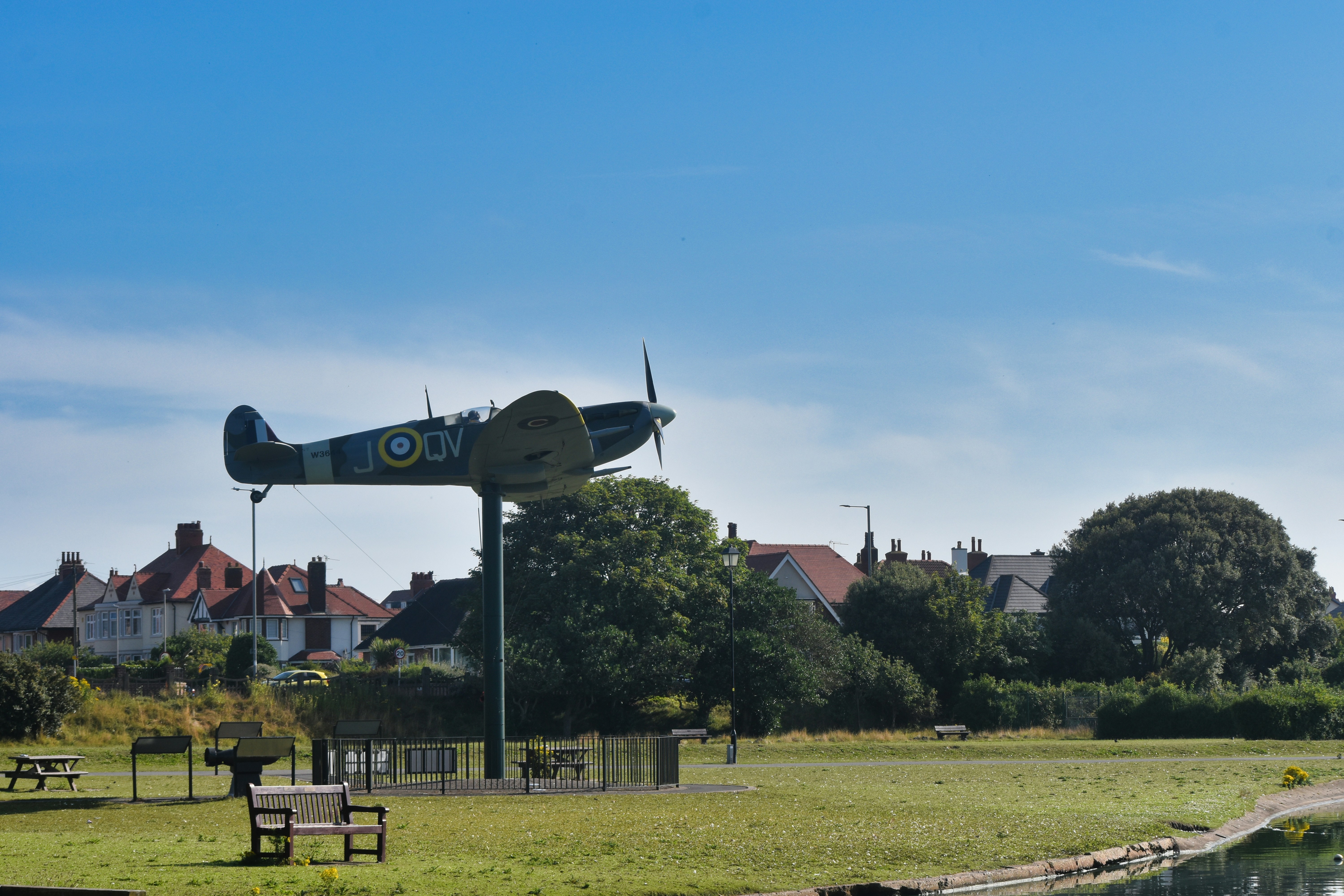 A park with benches and a statue of a plane photo – Free Lytham saint ...
