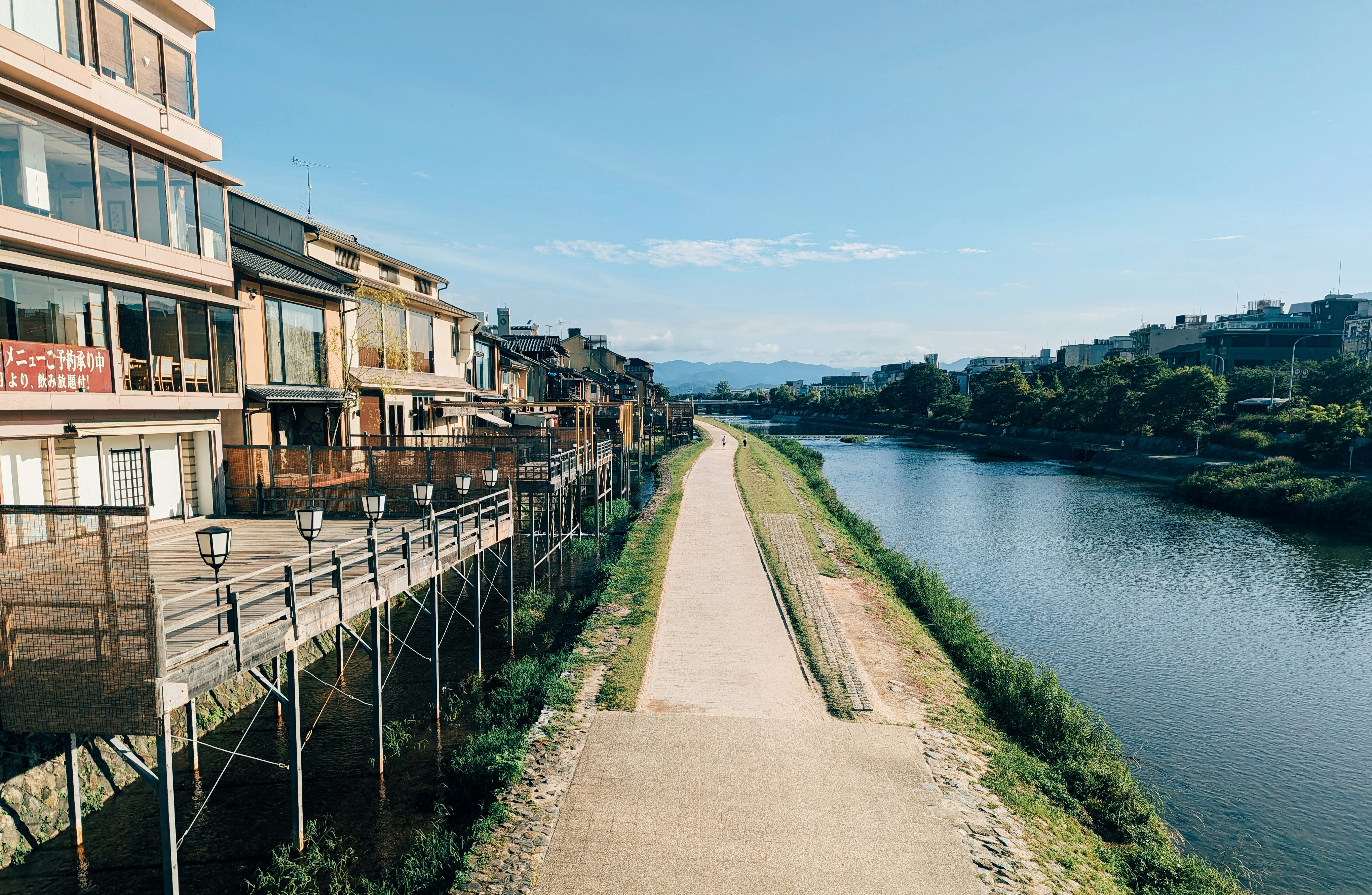 Riverside Alley: A Sunlit Path Between Waterfront Homes