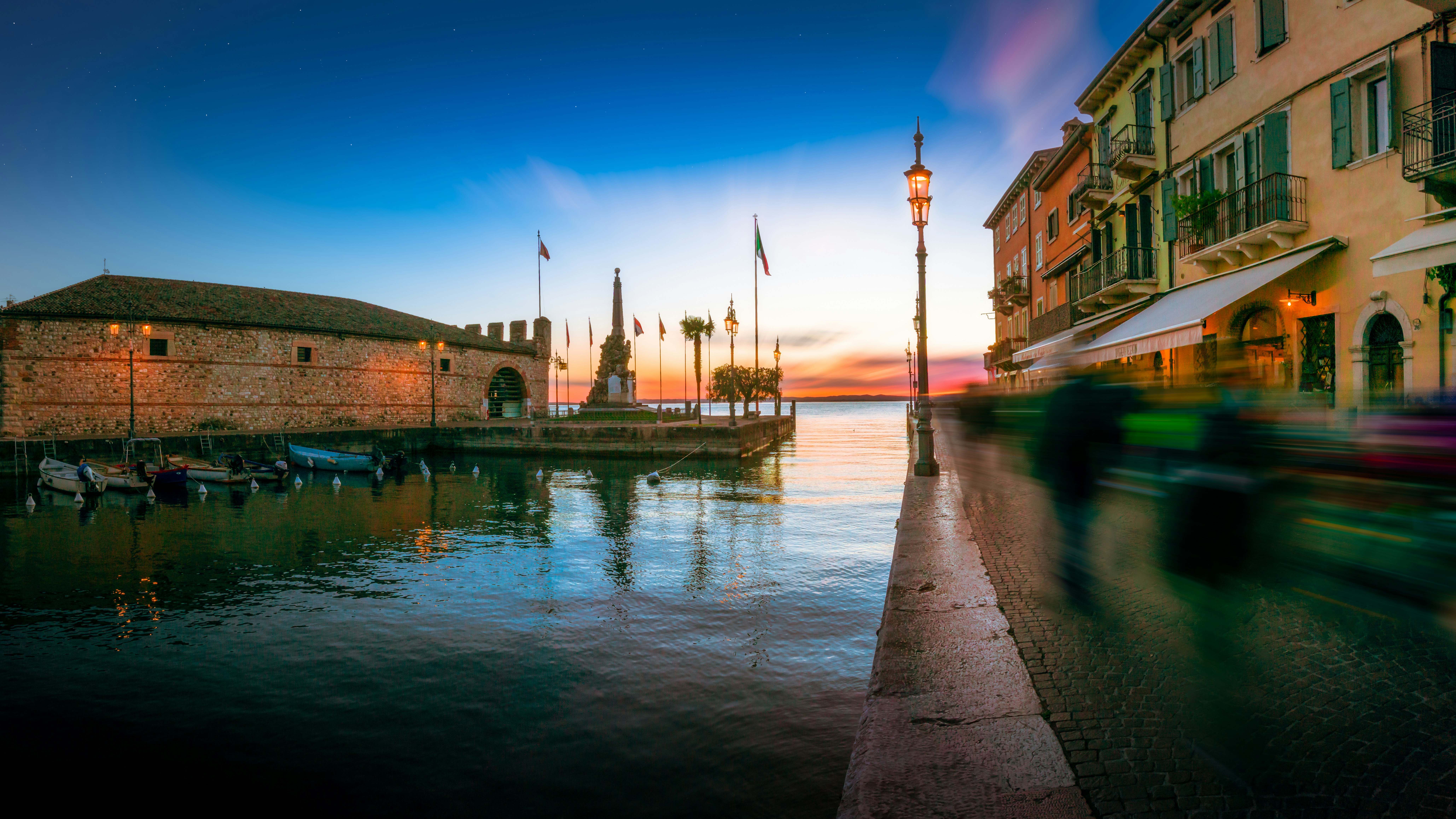 Dusk at the Quay: Lantern Glow and Ghostly Pedestrians
