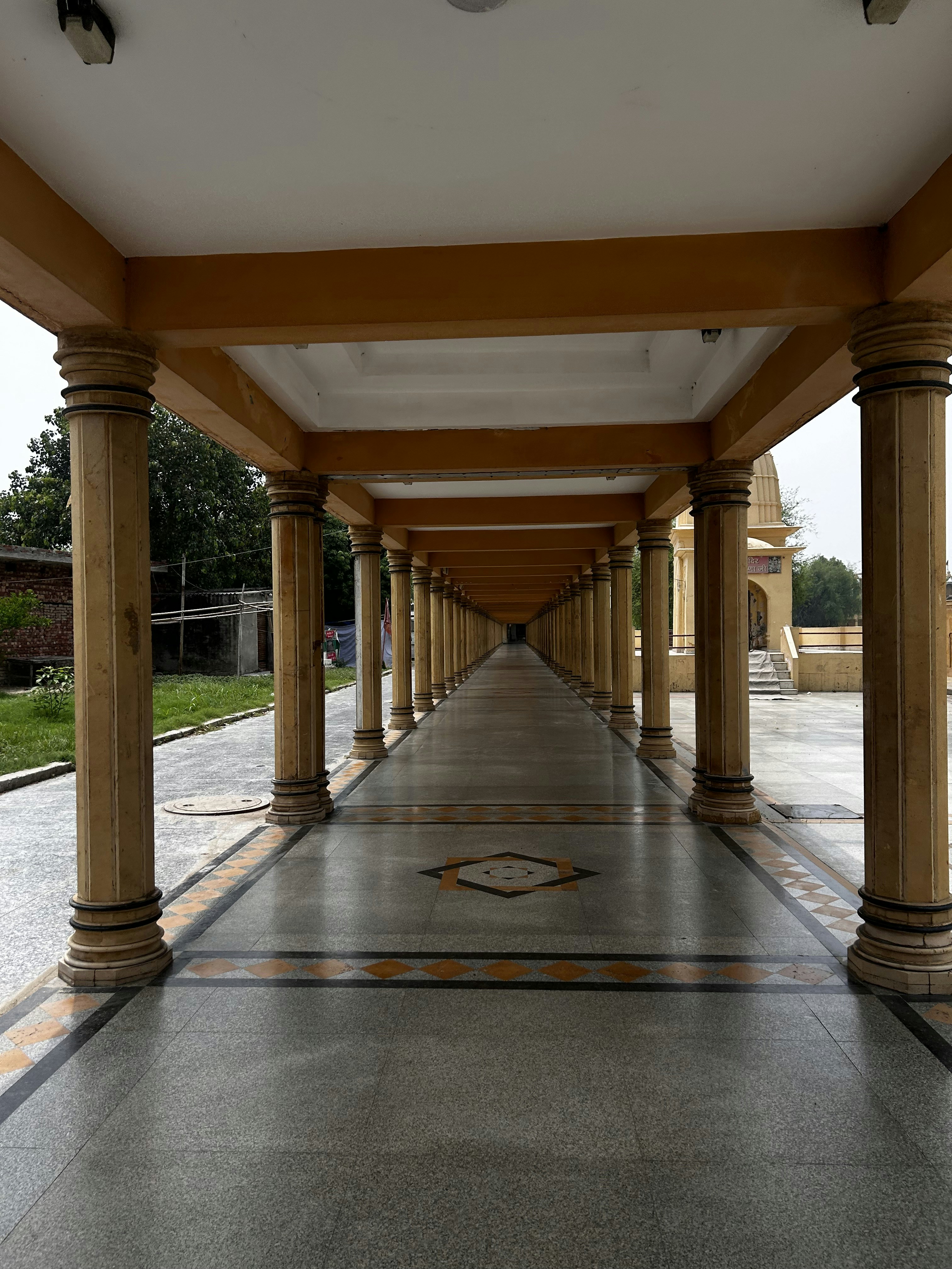 Convergence of Columns: A Corridor Stretching Toward a Distant Vanishing Point