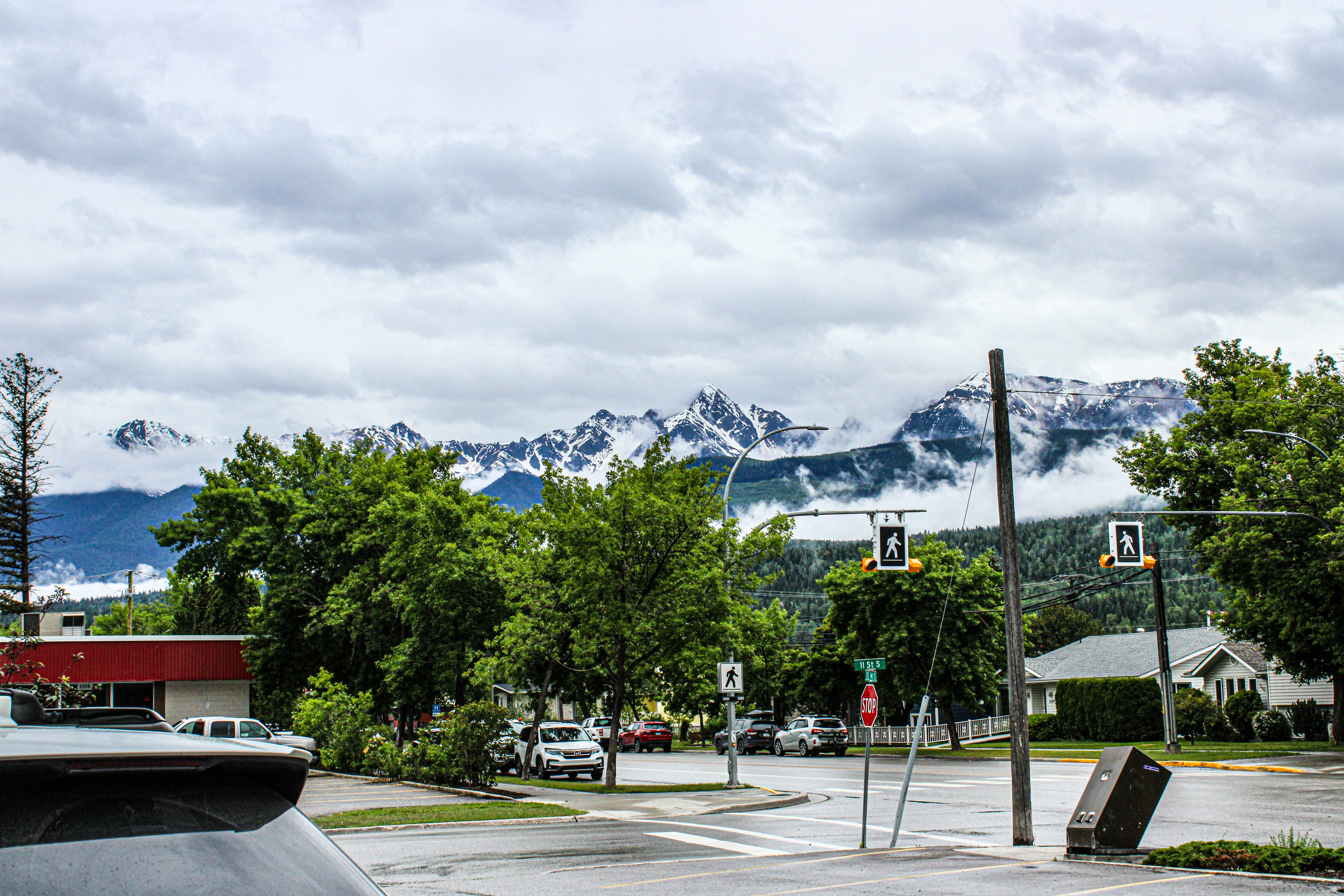 Snowcapped Backdrop Over a Quiet Town Street