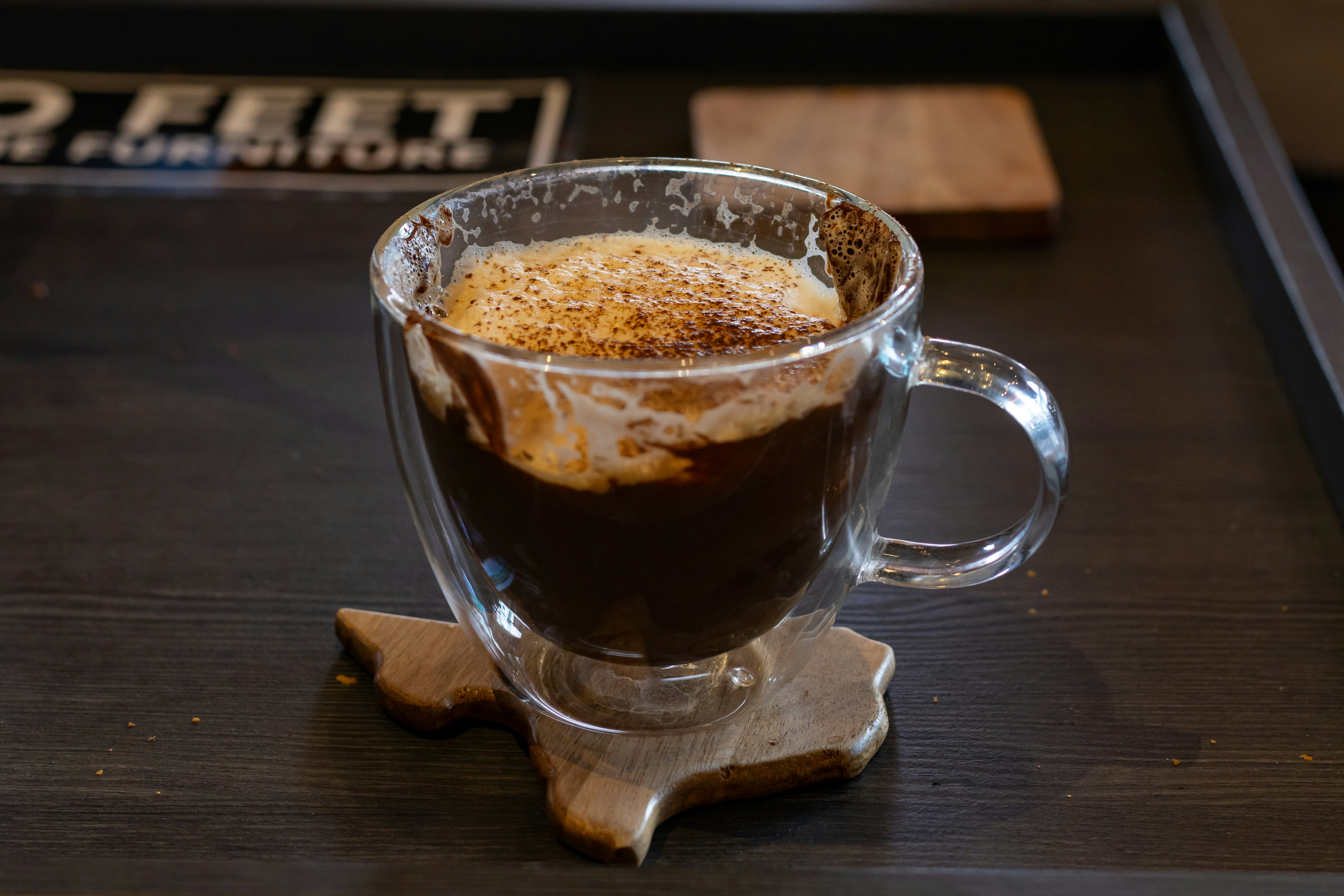 Taken at The Spin Coffee and Vinyl in San Antonio. I got the mocacchino, I think it was called. It has nutella in it. | A cup of coffee sitting on top of a wooden table