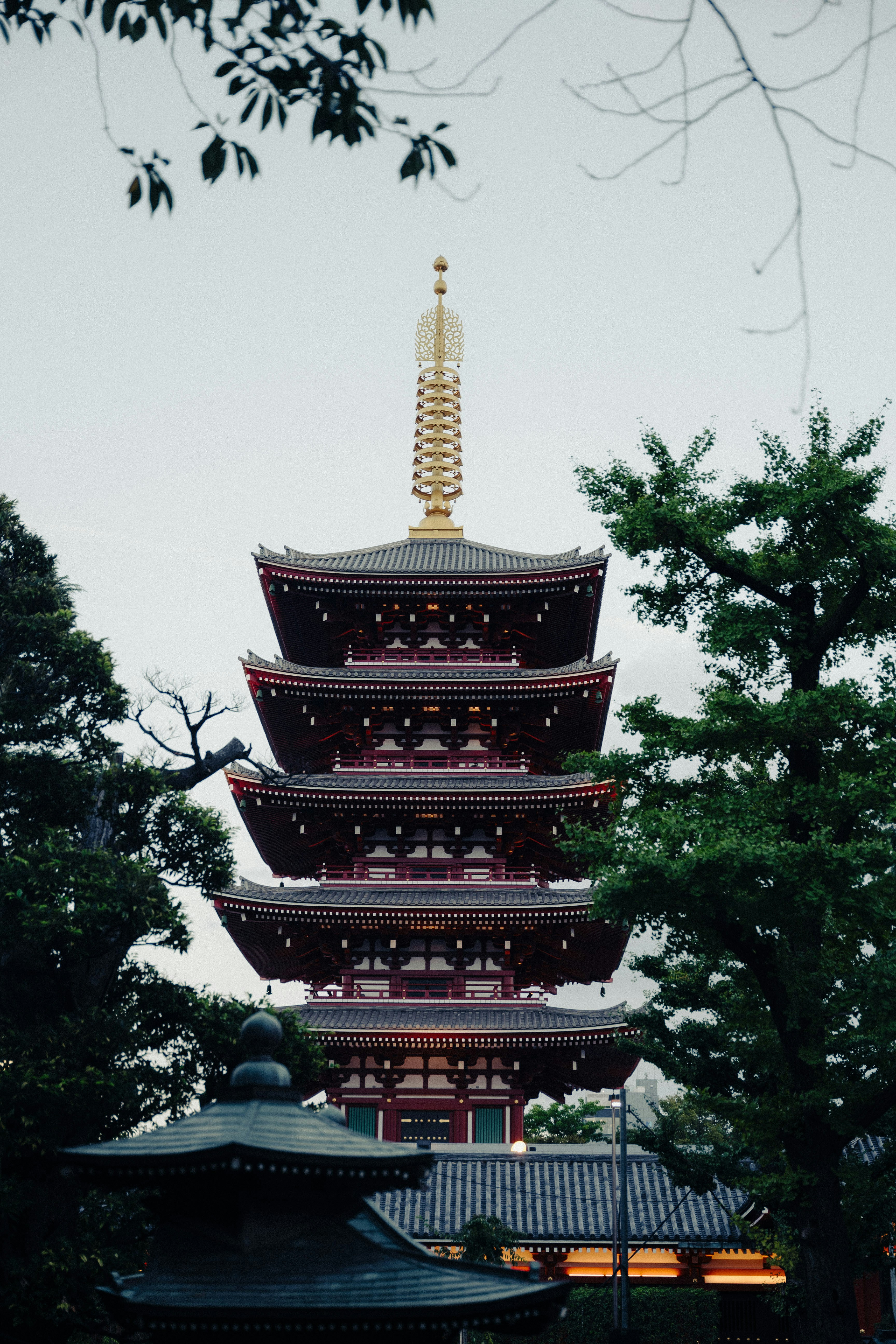 A tall pagoda tower sitting next to a forest photo – Free 2 chome-3-1 ...