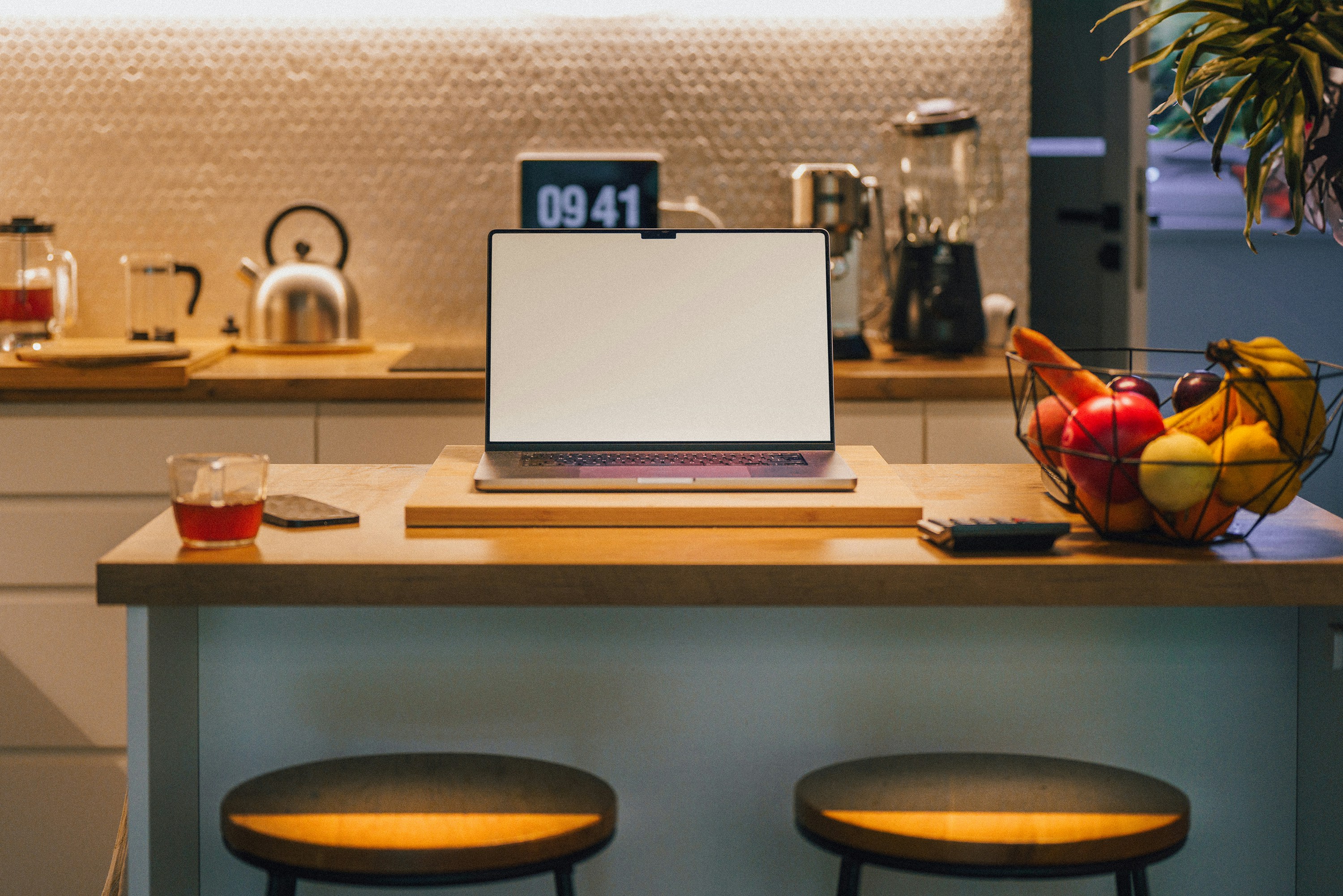 A laptop computer sitting on top of a kitchen counter photo – Free ...