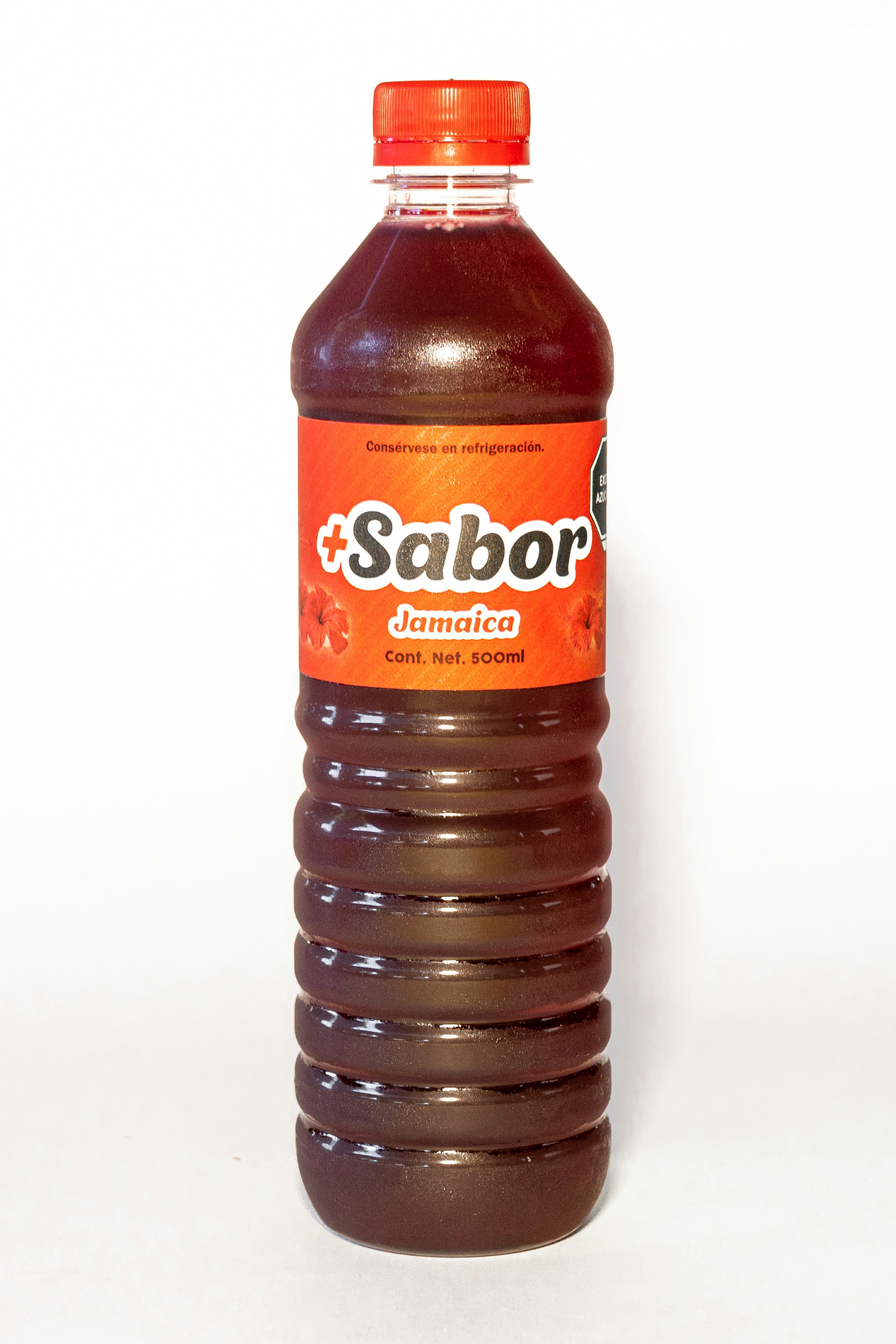 Sabor Jamaica in Studio Light: A Ribbed Amber Juice Bottle