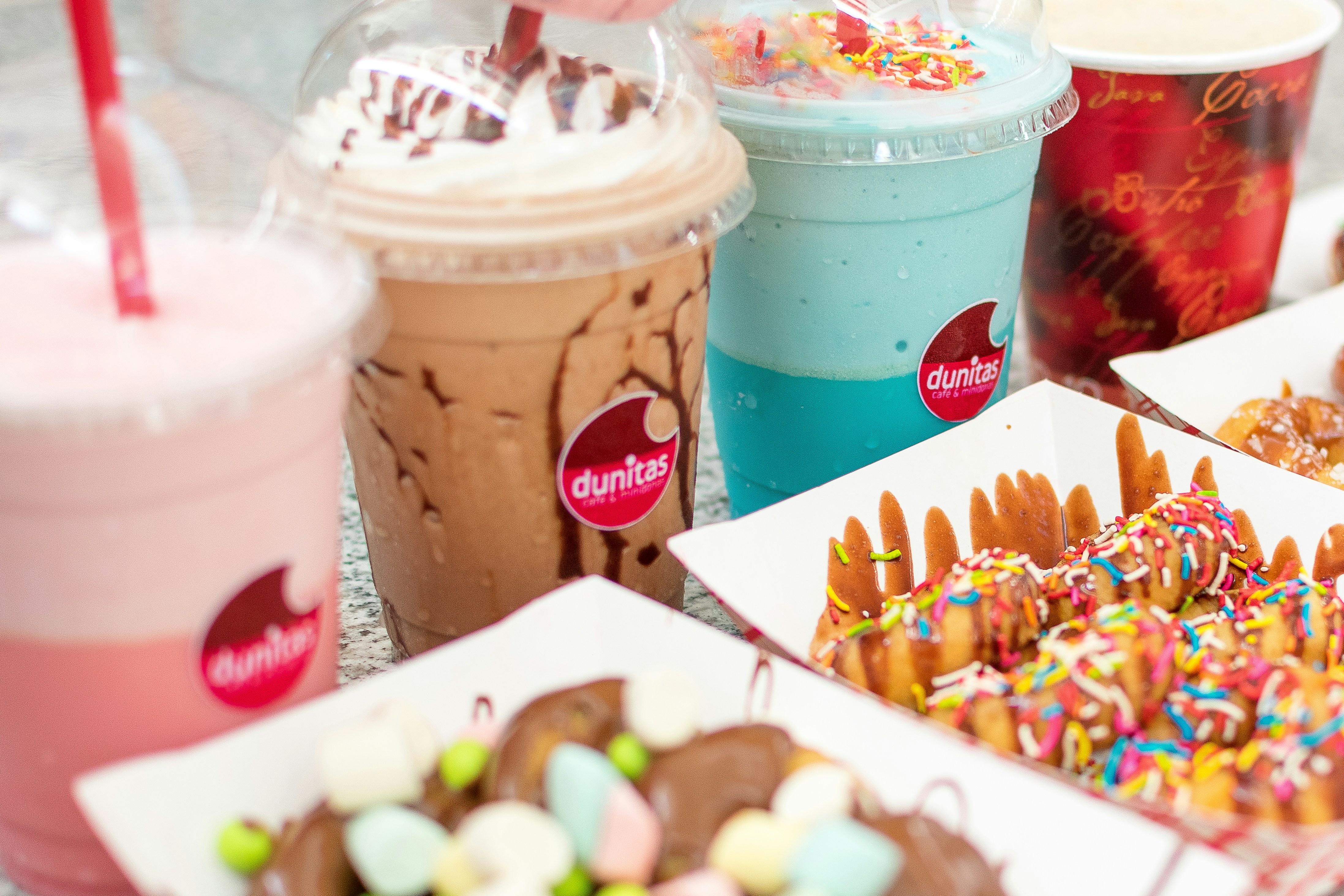 Dolly Delights: A Colorful Spread of Frosted Treats and Milkshakes