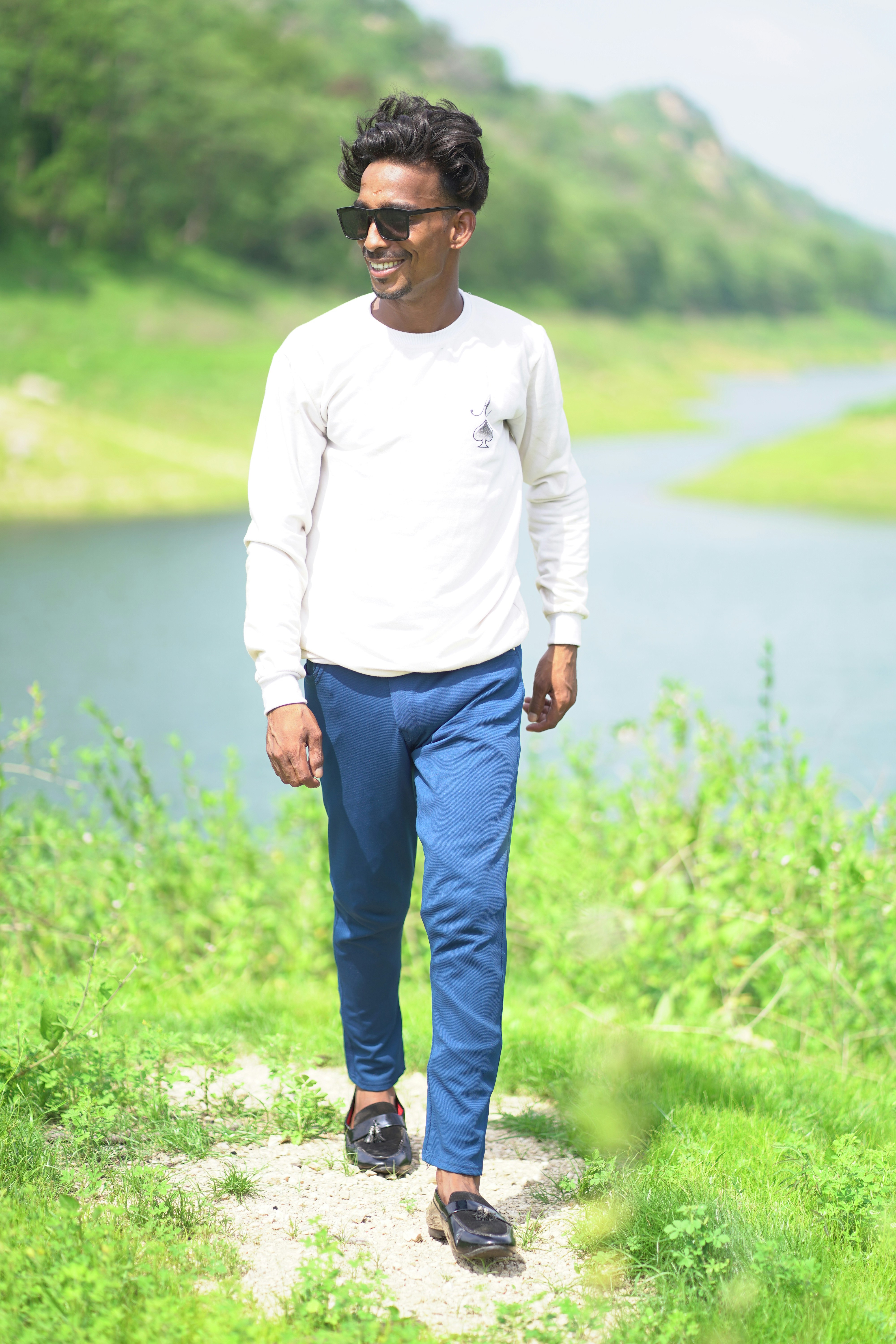 Riverbank Stroll: A sunlit portrait of casual confidence