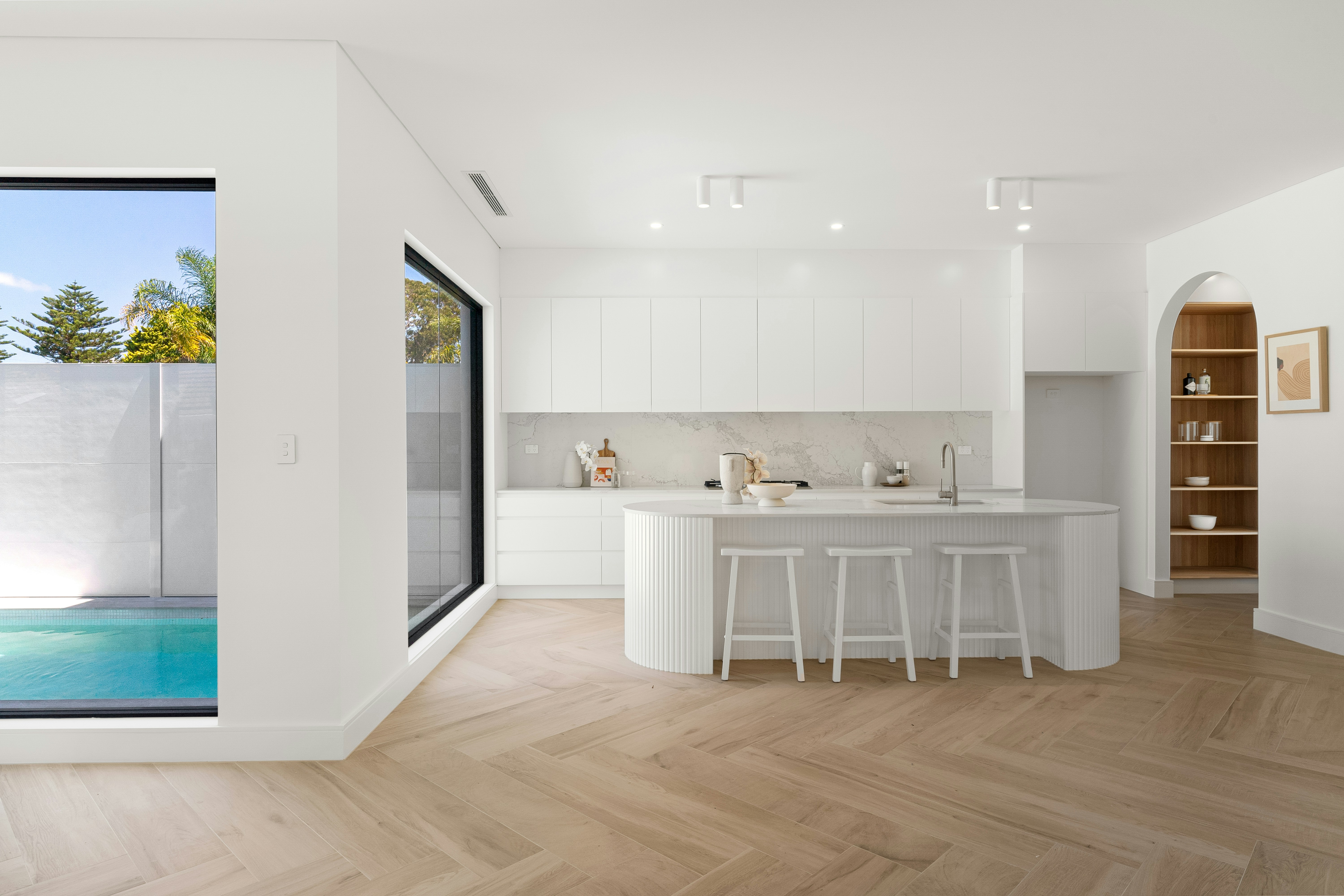 A large open kitchen with a pool in the center photo – Free Interior ...