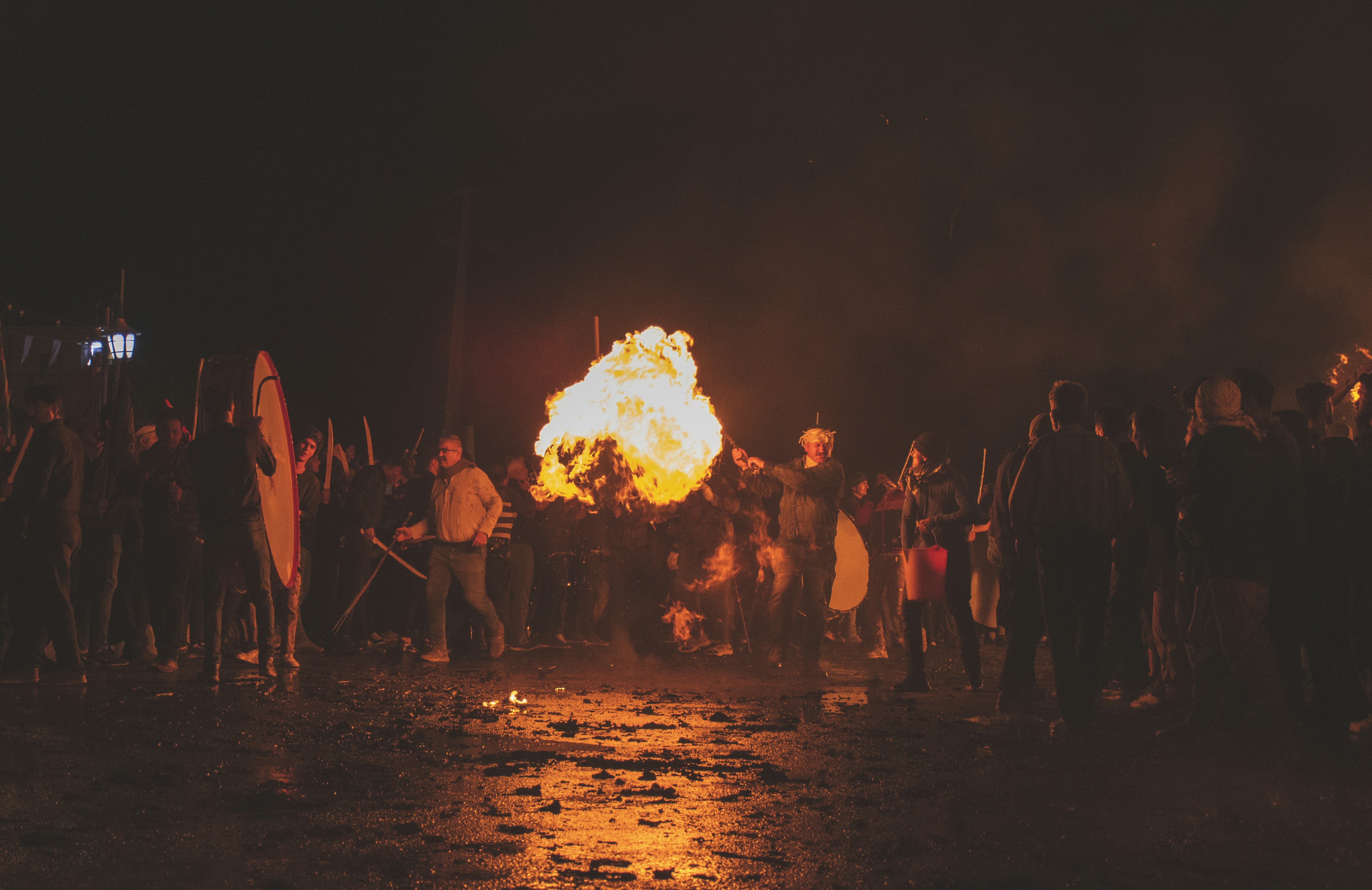 A group of people standing around a fire photo – Free East azerbaijan ...