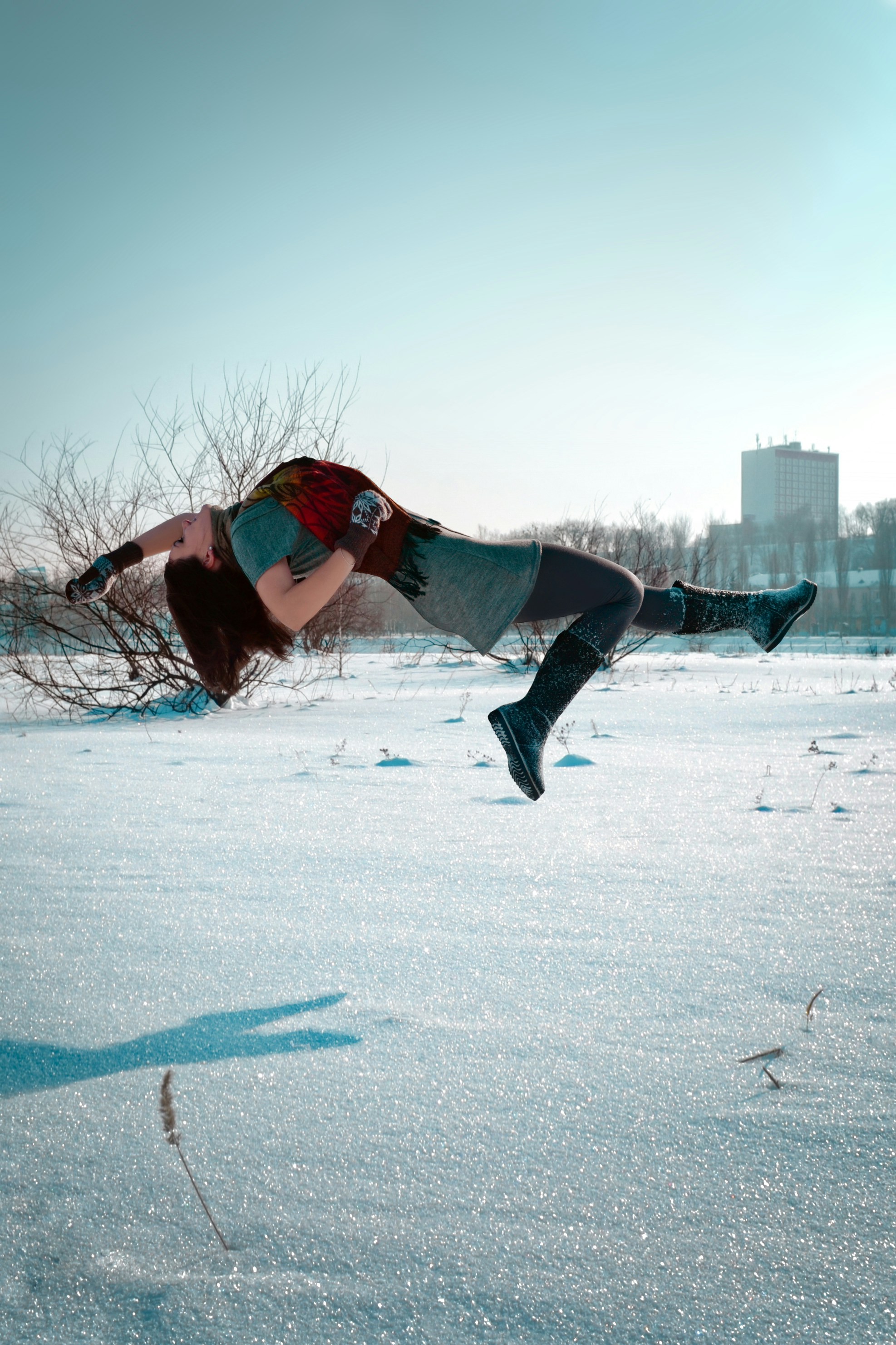 Icebound Leap: A Dancer Flips Across a Frosted Field