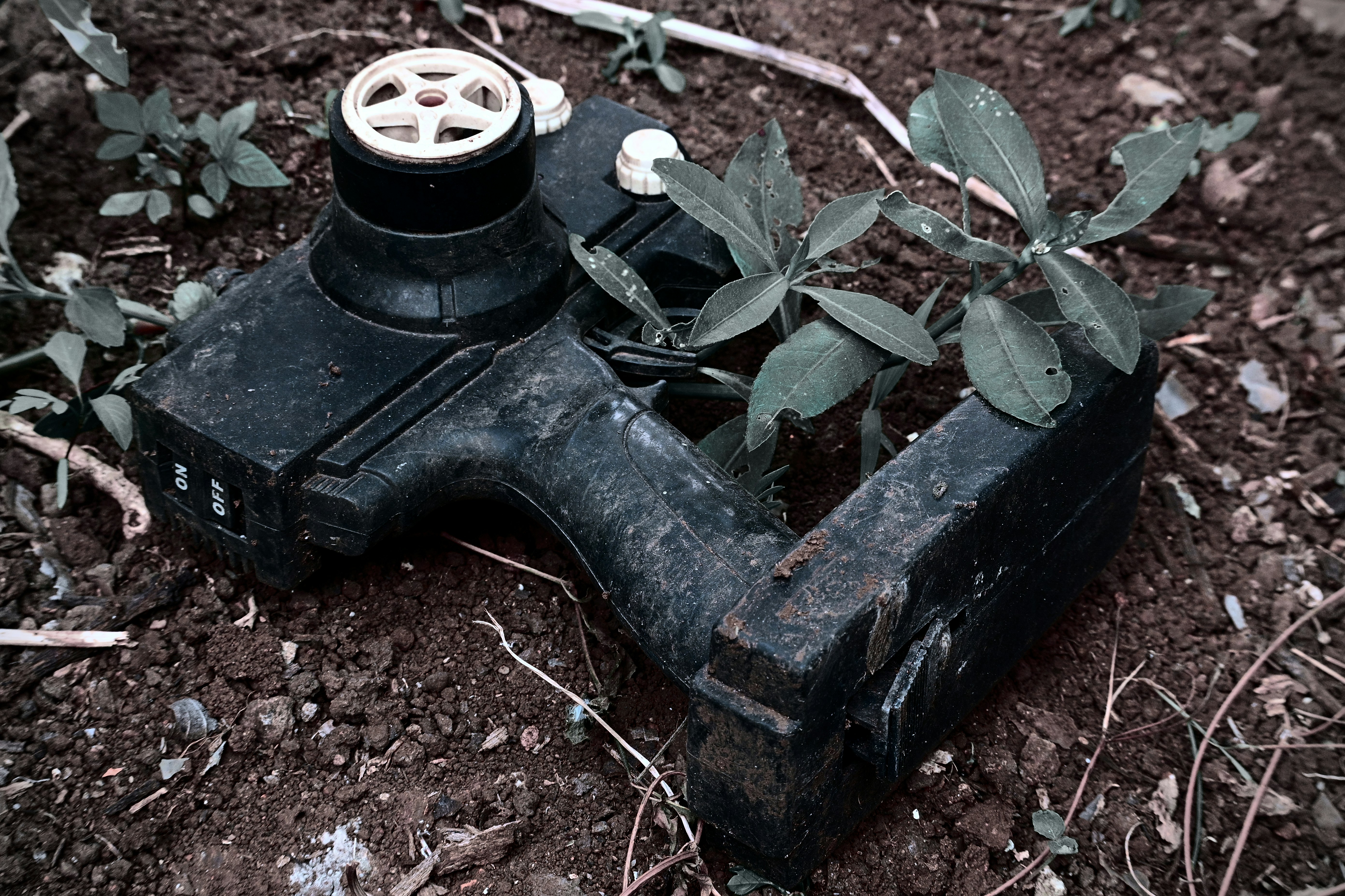 An old video game controller laying on the ground photo – Free Remote ...