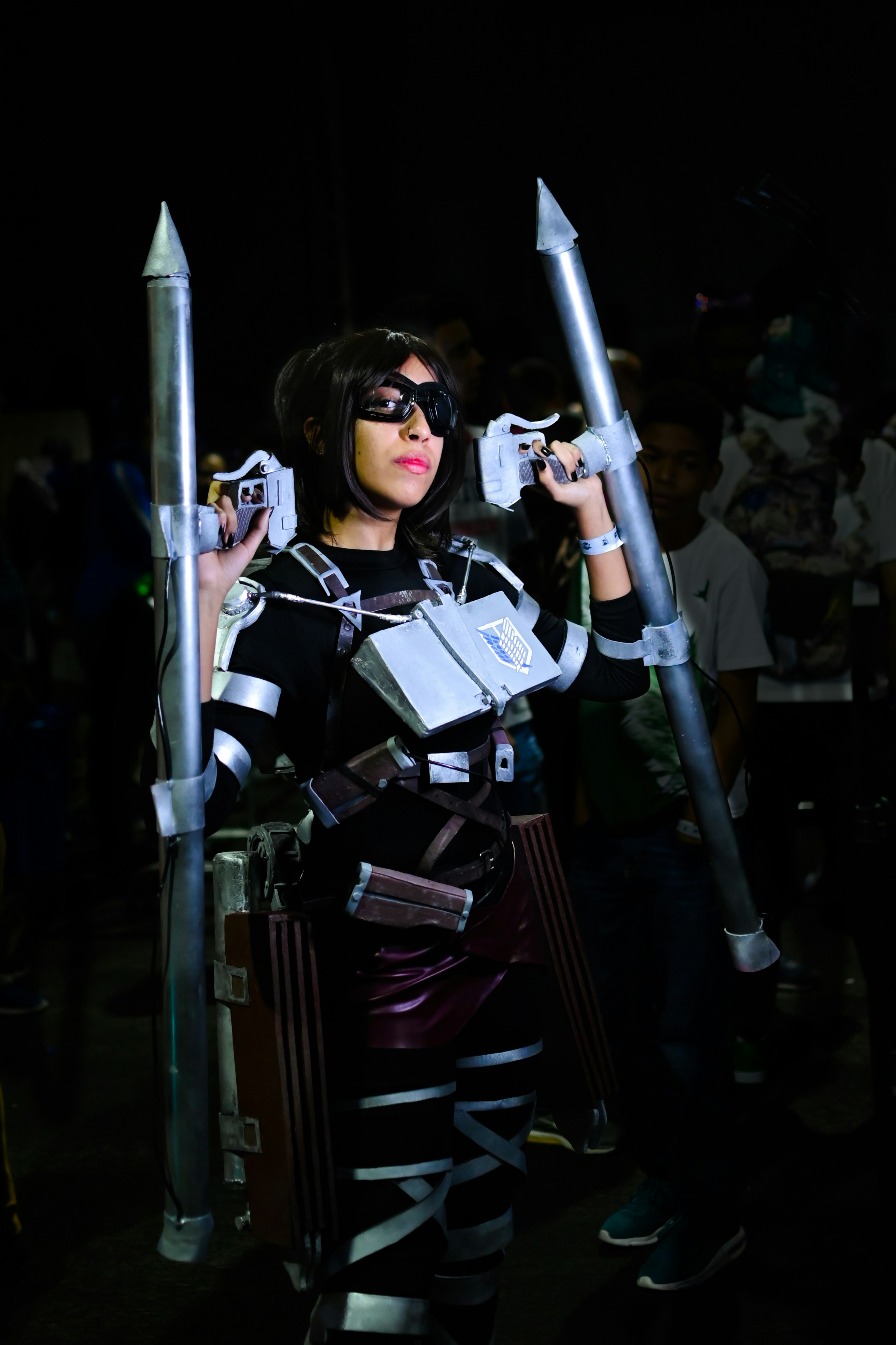 A woman dressed in a cosplay costume holding a sword photo – Free ...