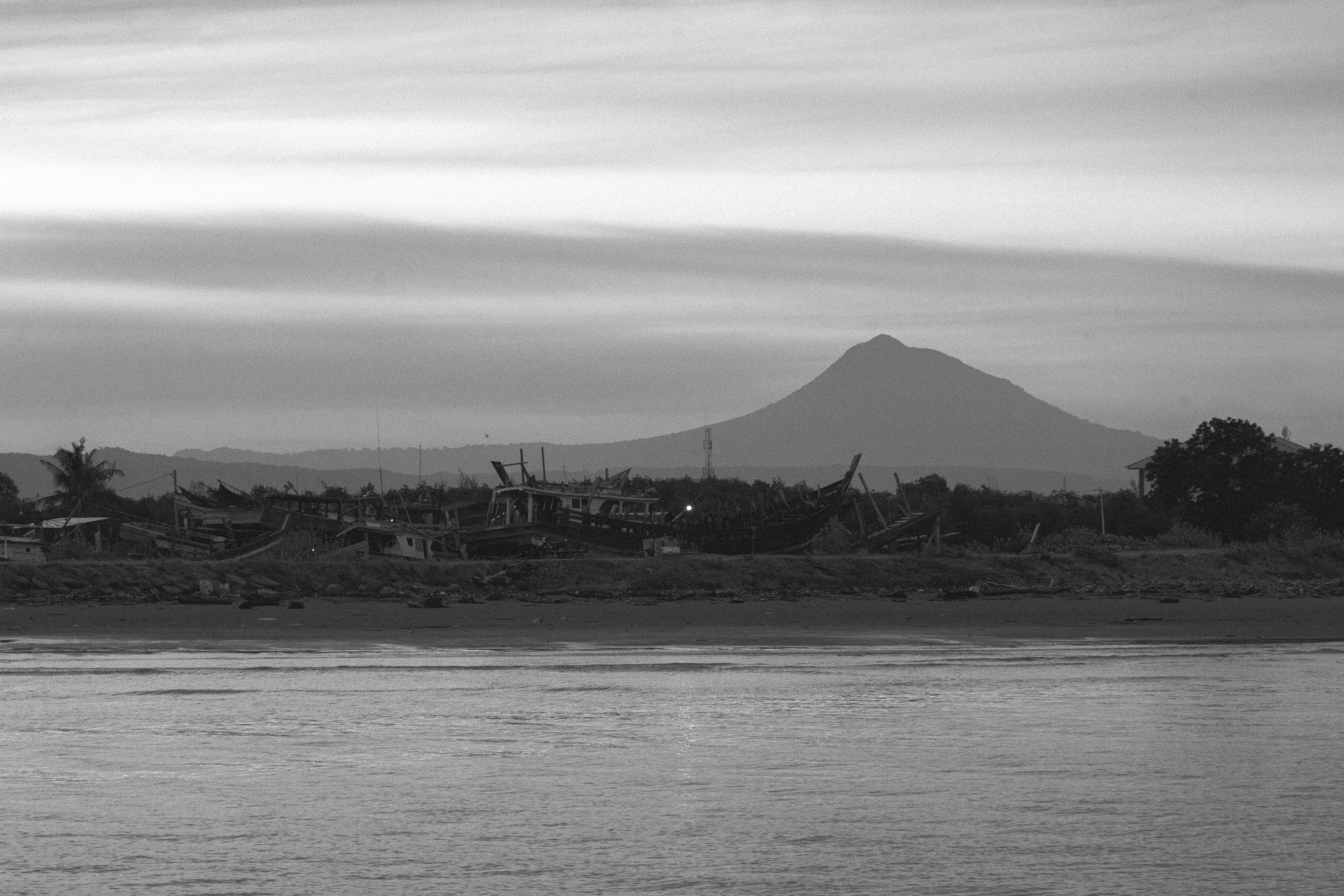 Horizon’s Conical Peak Over a Quiet Shoreline