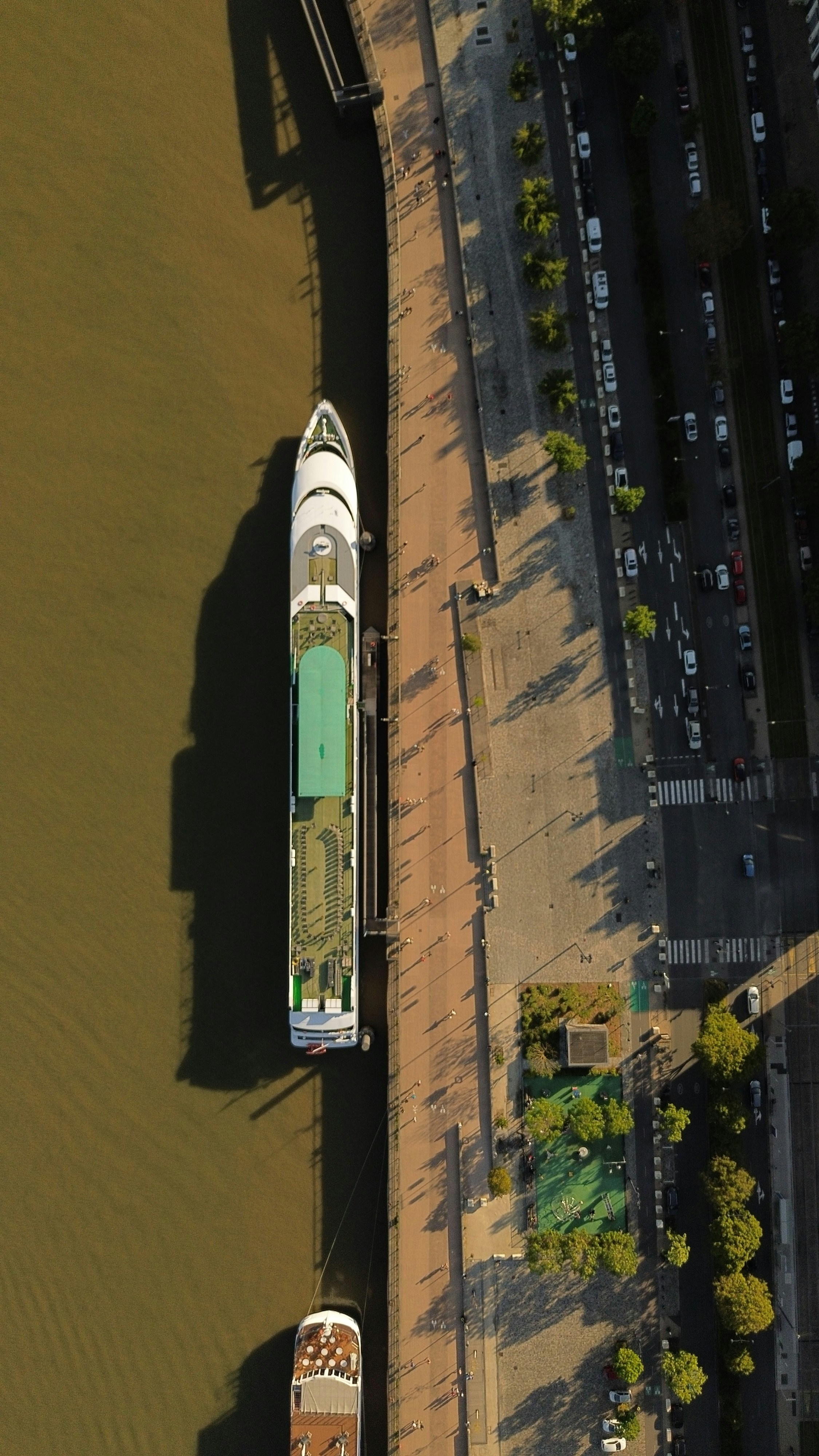 Promenade Quay: Aerial Portrait of a Docked Vessel and Riverfront