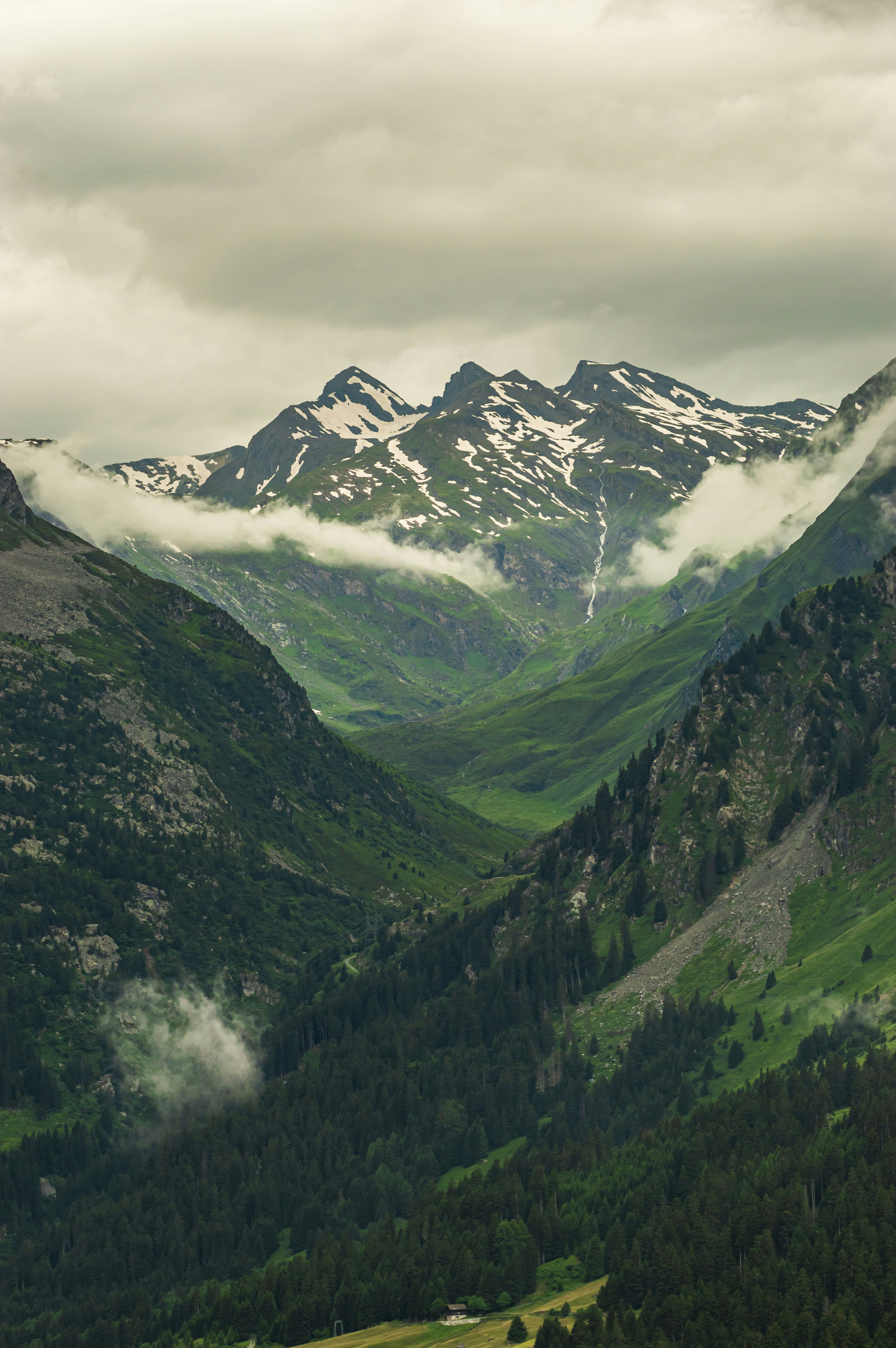 A view of a valley with mountains in the background photo – Free Nature ...