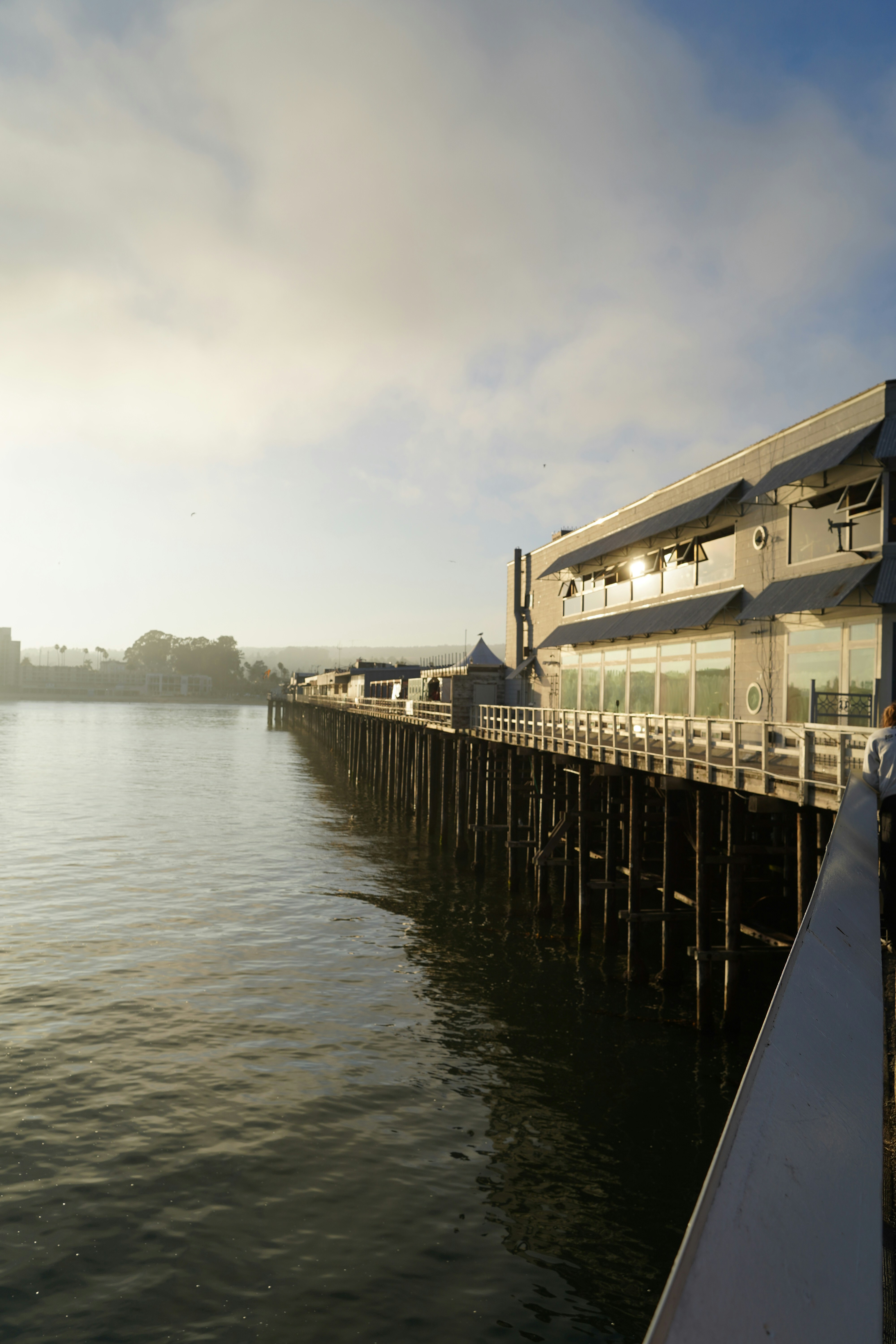 Edge of the Tide: Morning Light on a Glass-Walled Wharf