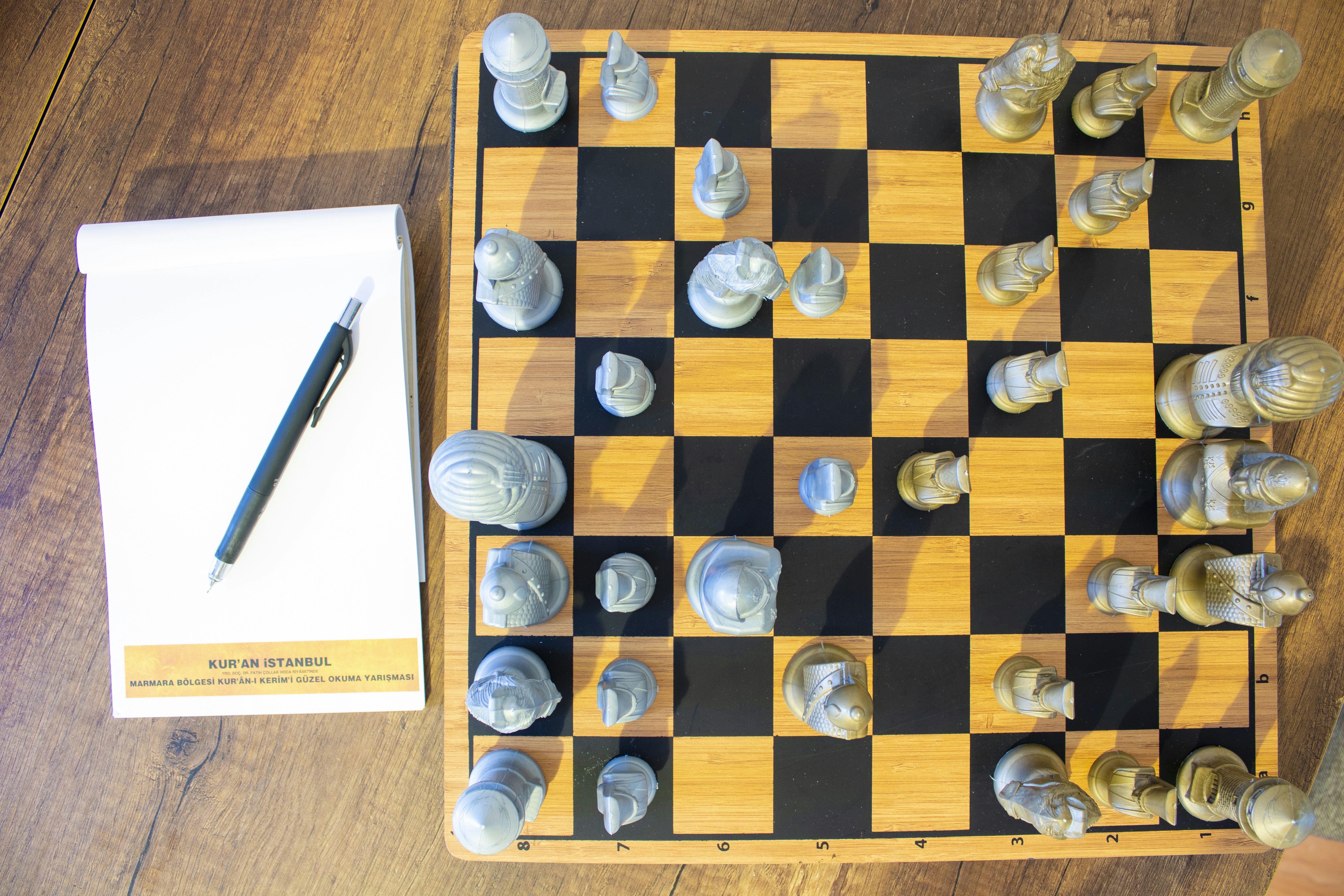 A chess board with a pen on top of it photo – Free Chess Image on Unsplash