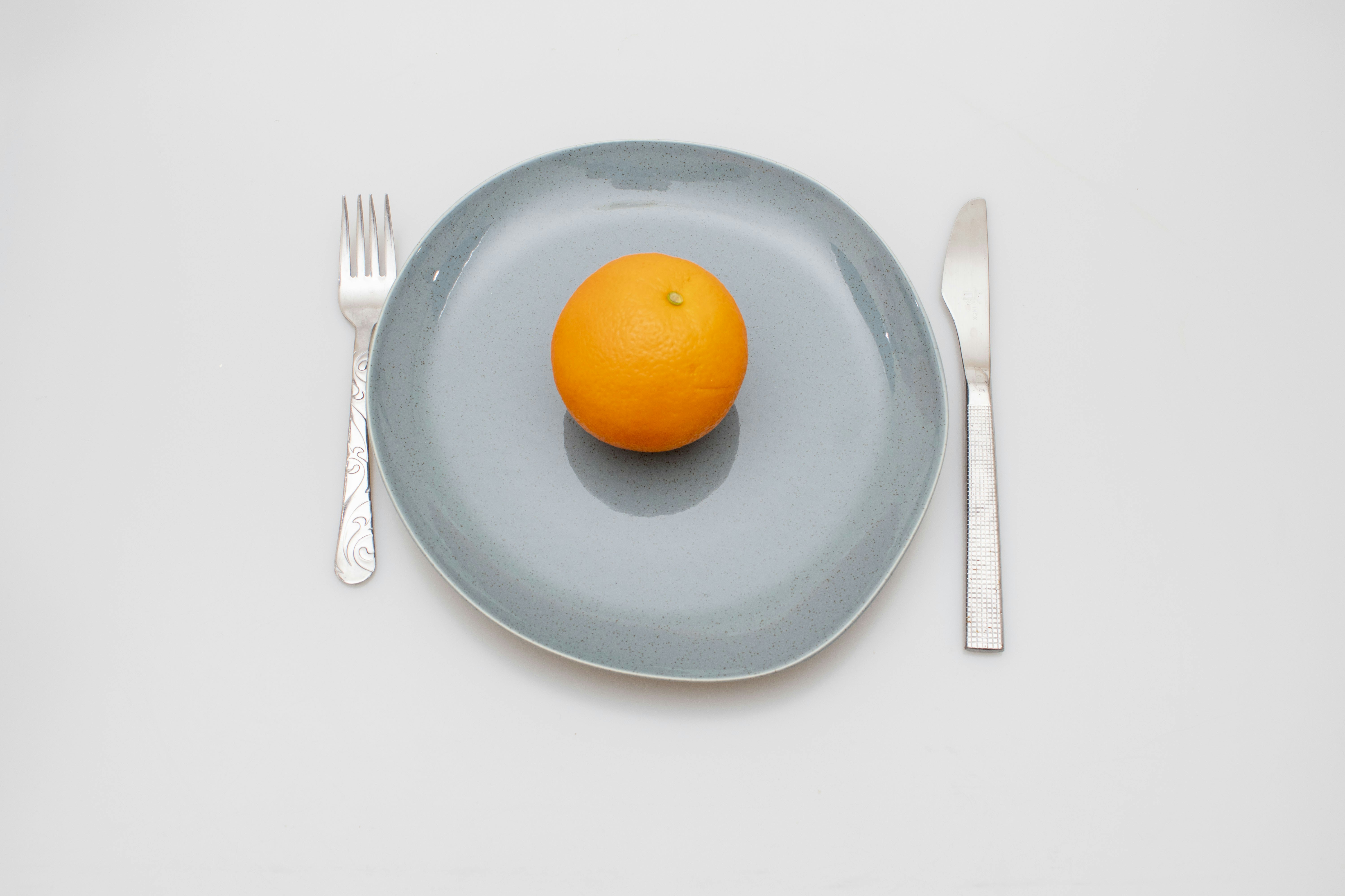 a few oranges on a plate