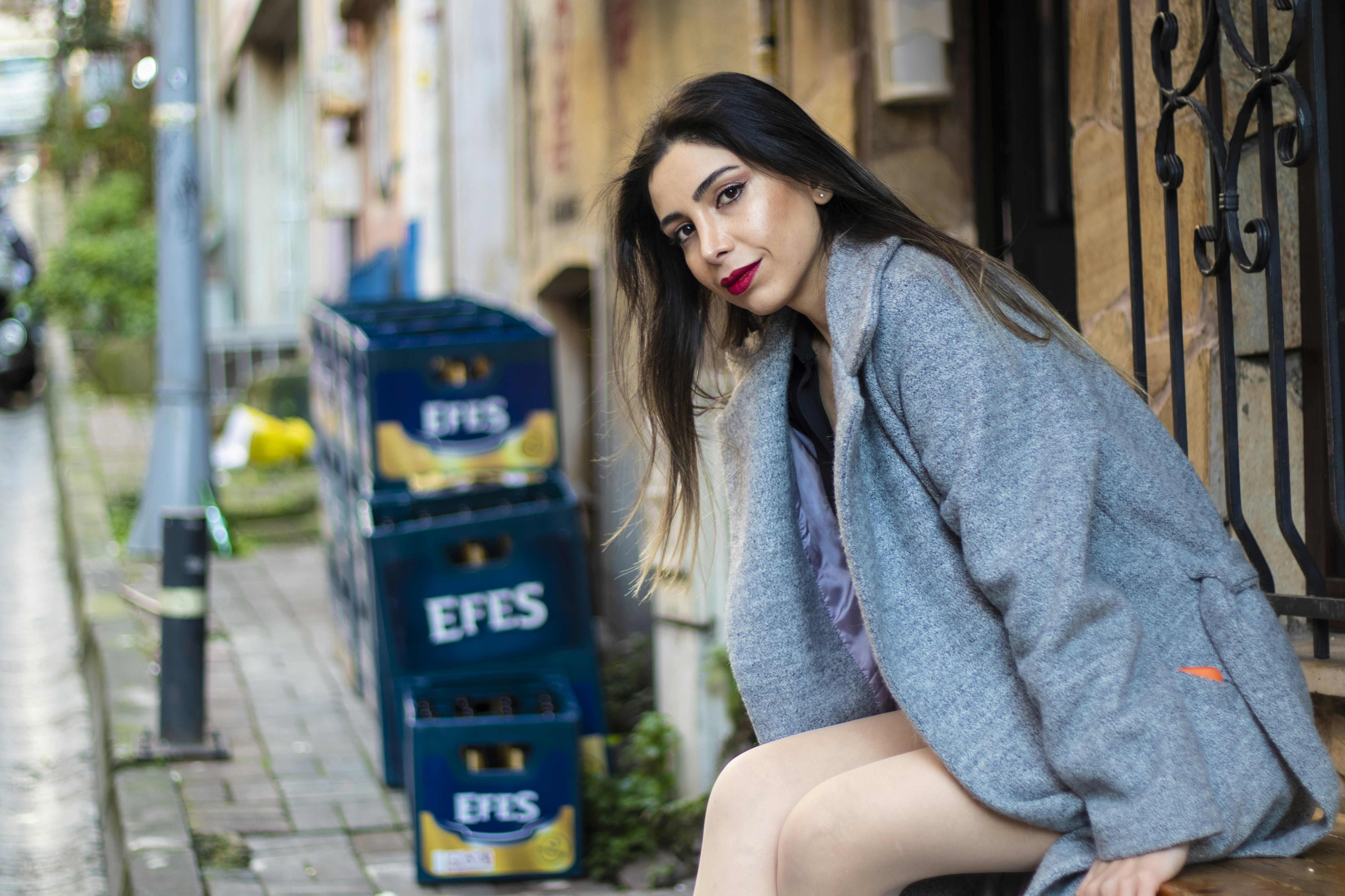 Urban Vogue: A Quiet Moment on the Sidewalk Stage