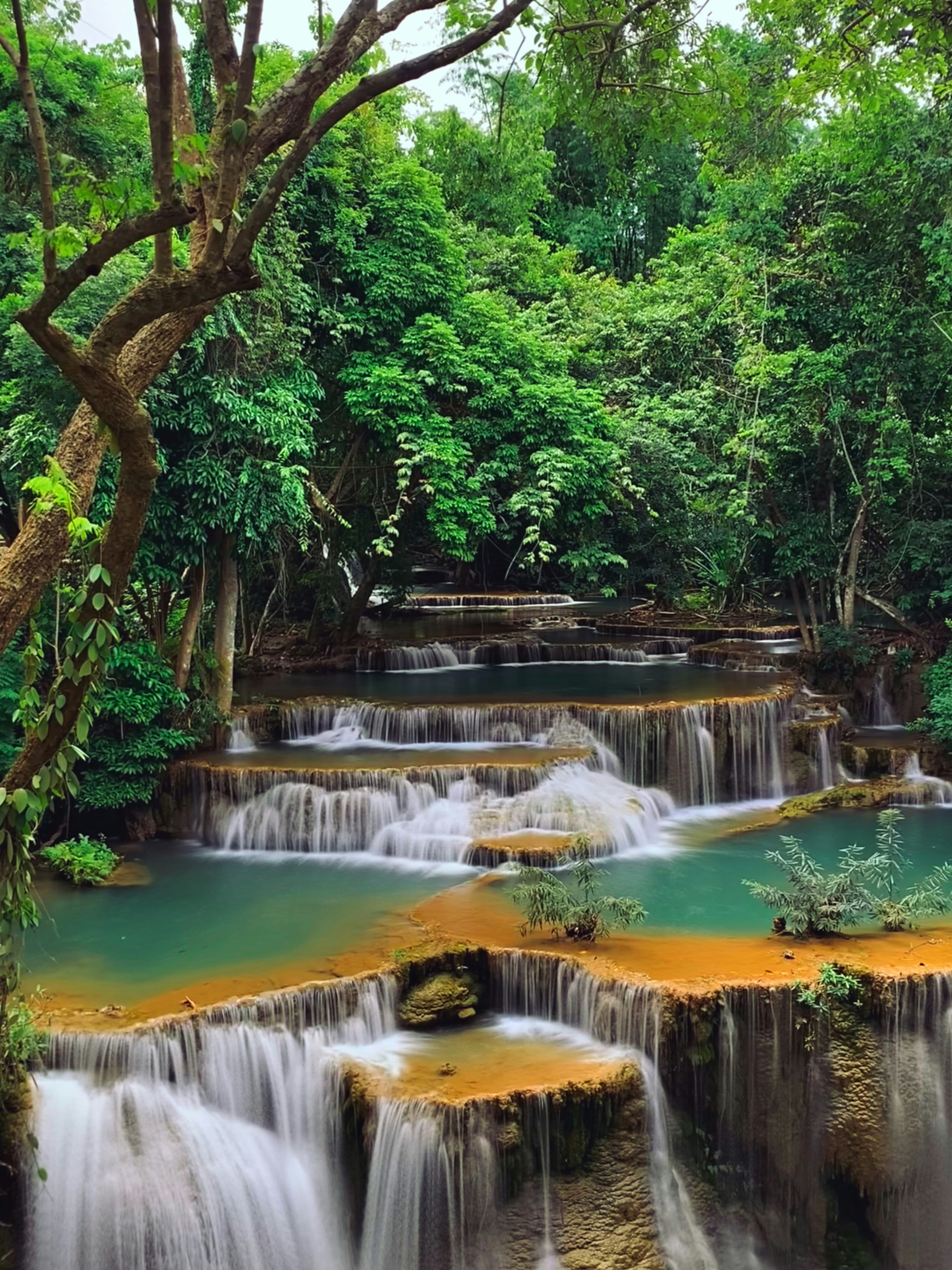 A small waterfall in the middle of a forest photo – Free Thailand Image ...