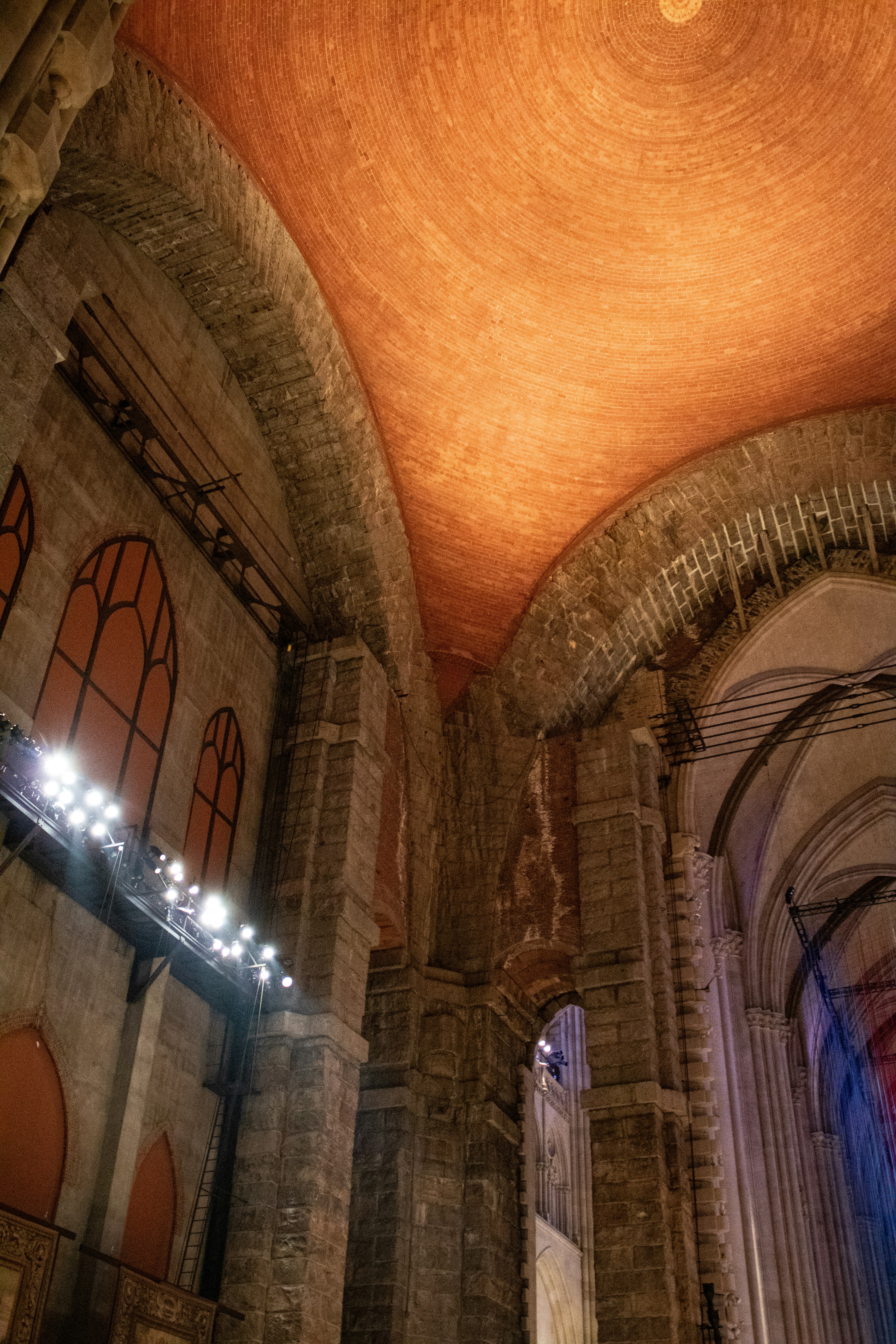 Ember Vaults: Brick Arches and Copper Ceiling in a Cathedral Interior