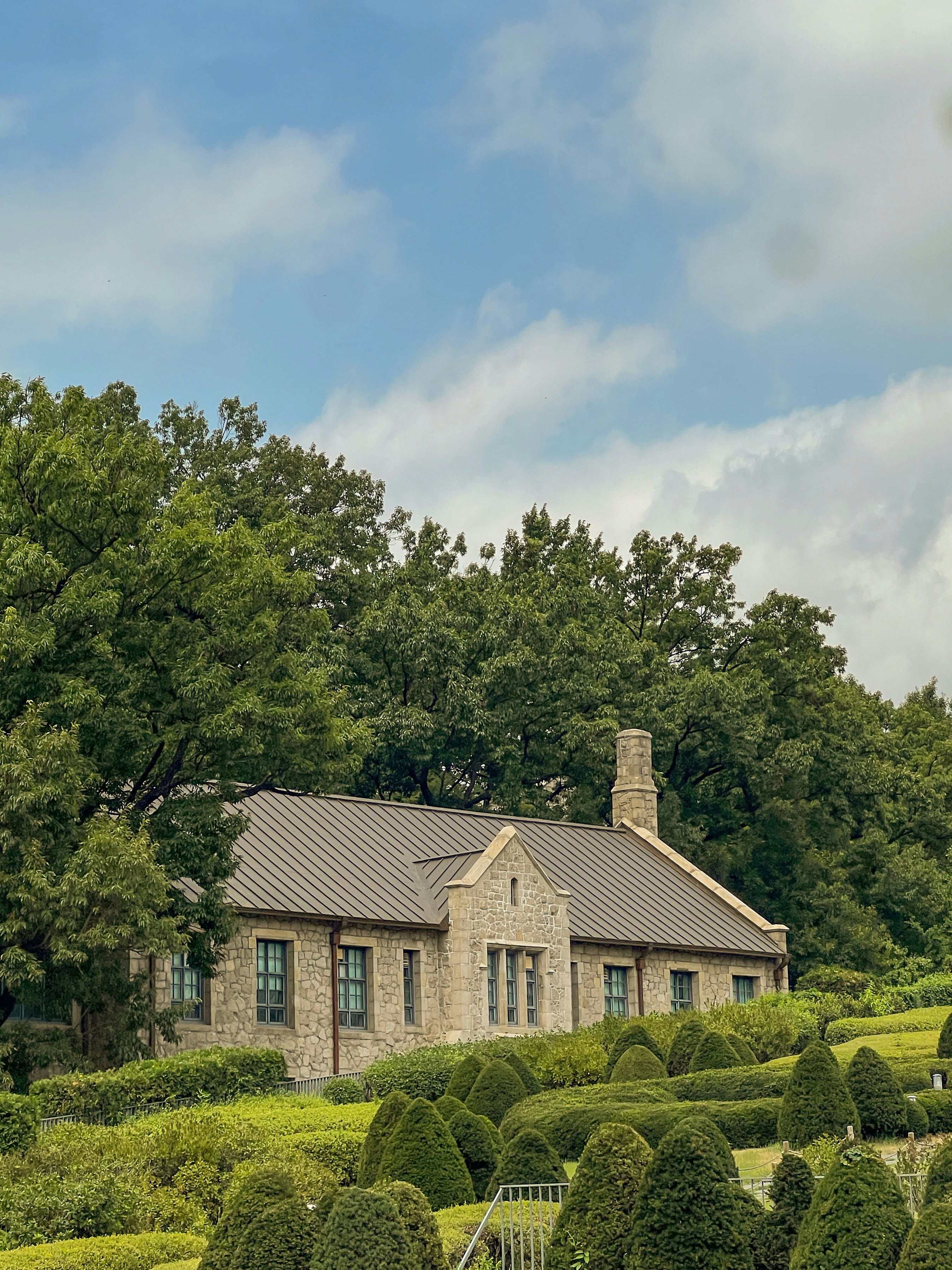 A large house surrounded by a lush green park photo – Free Ewha women's ...