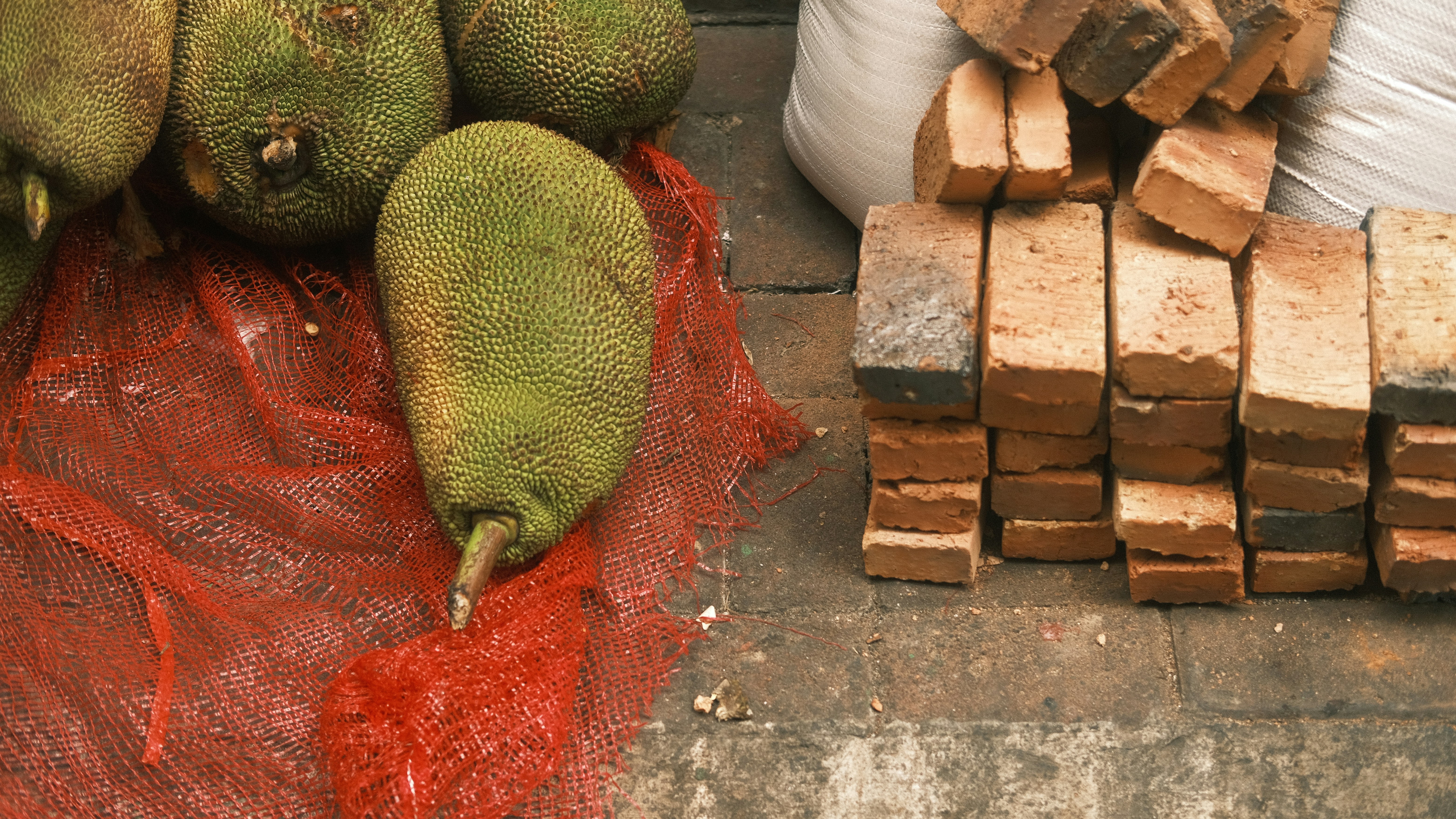A pile of fruit sitting on top of a red tarp photo – Free Food Image on ...
