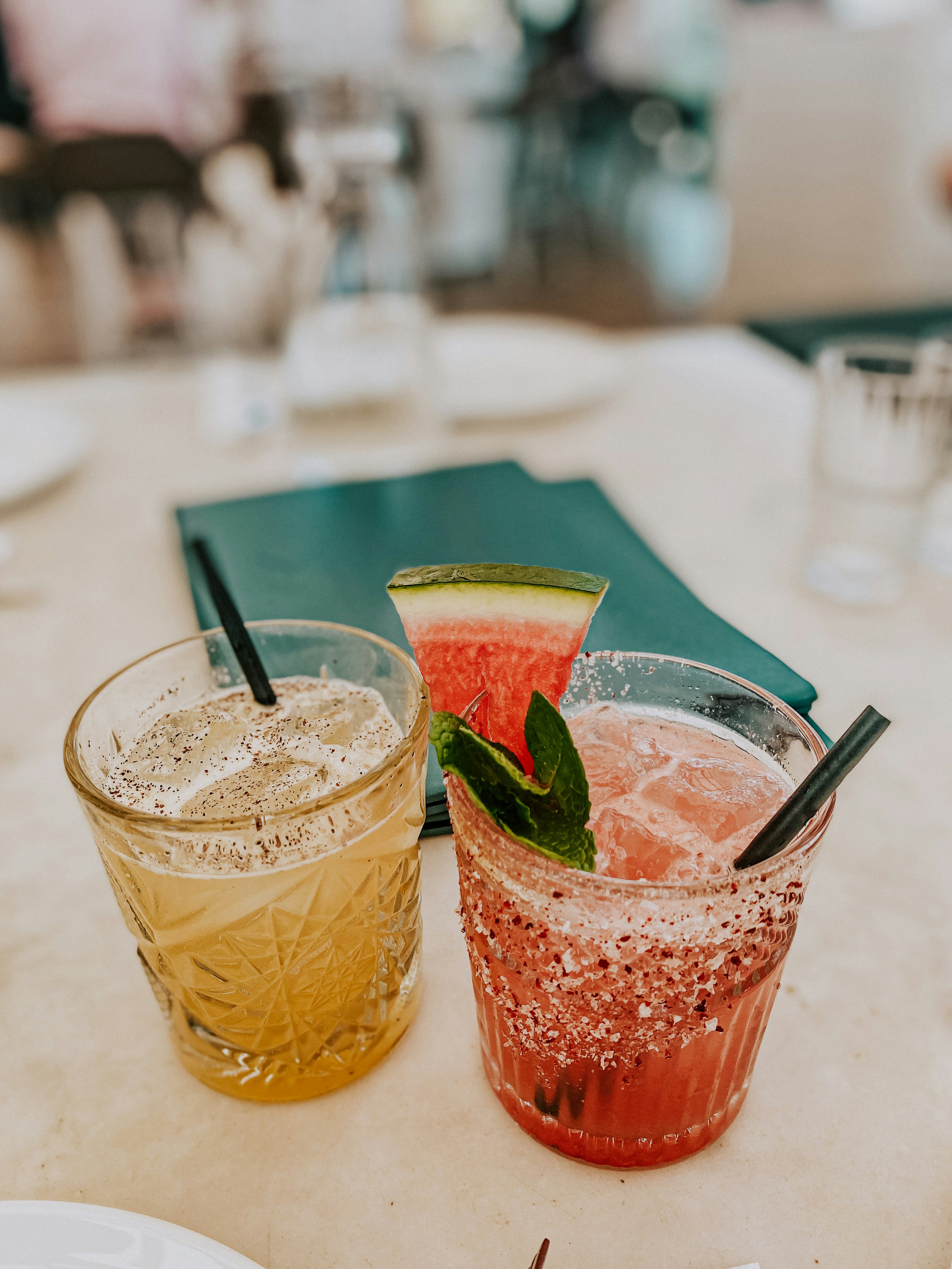 Sunlit Sauces: A Pair of Citrus-Glint Drinks on a Marble Table