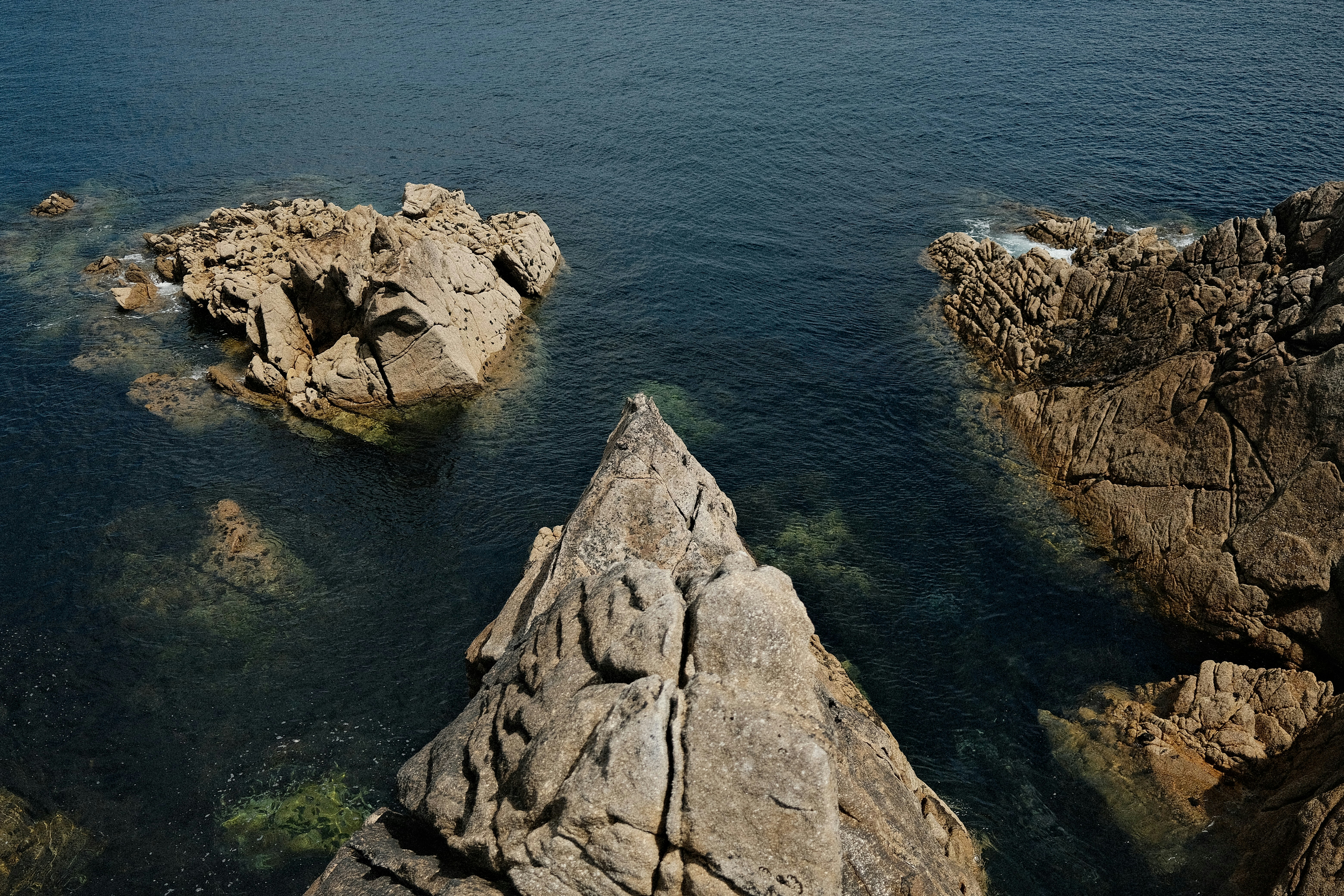 Promontory Prism: Rock Spire Rising Over Quiet Blue