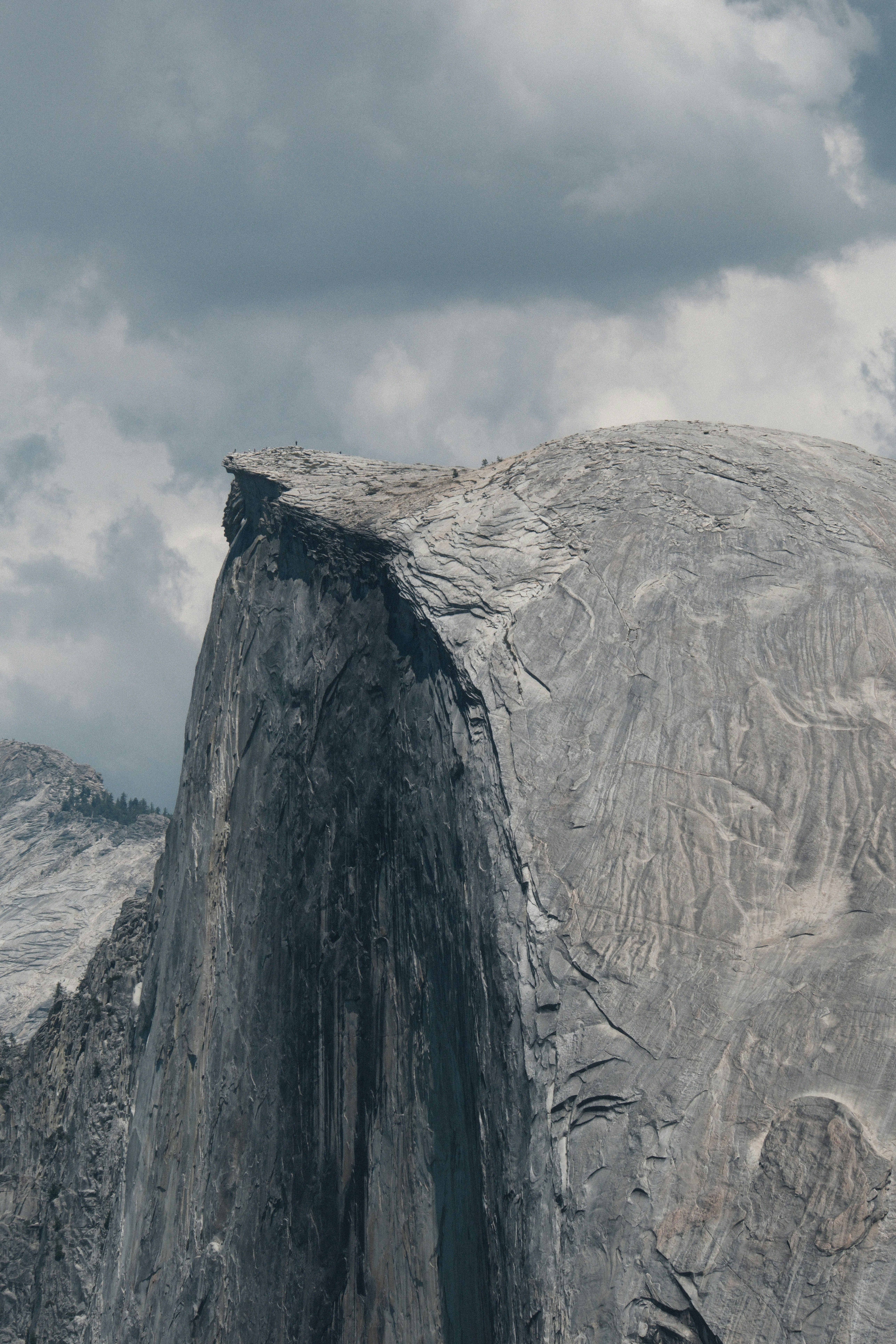 A large mountain with a very tall rock face photo – Free Minimal Image ...