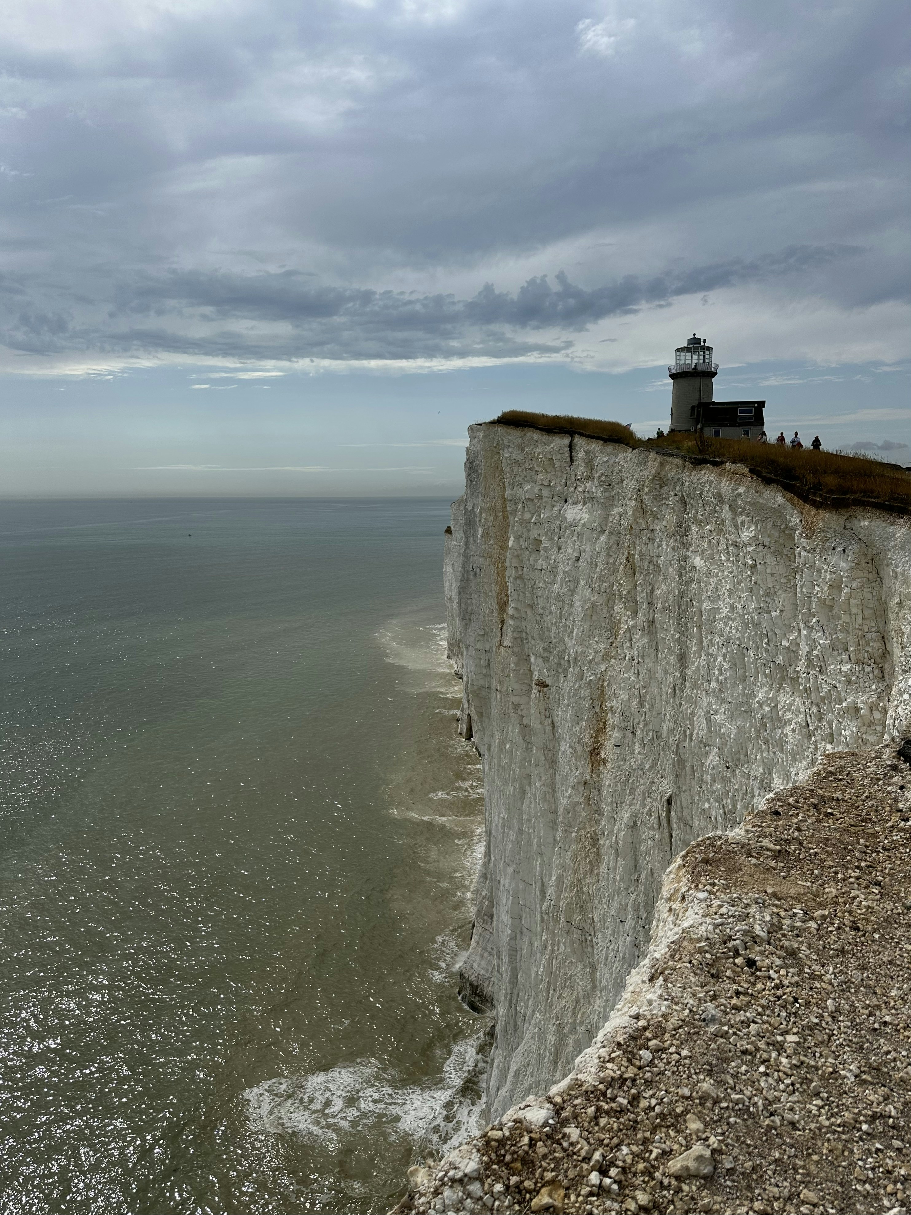 Lighthouse Sentinel on a Weathered Cliff