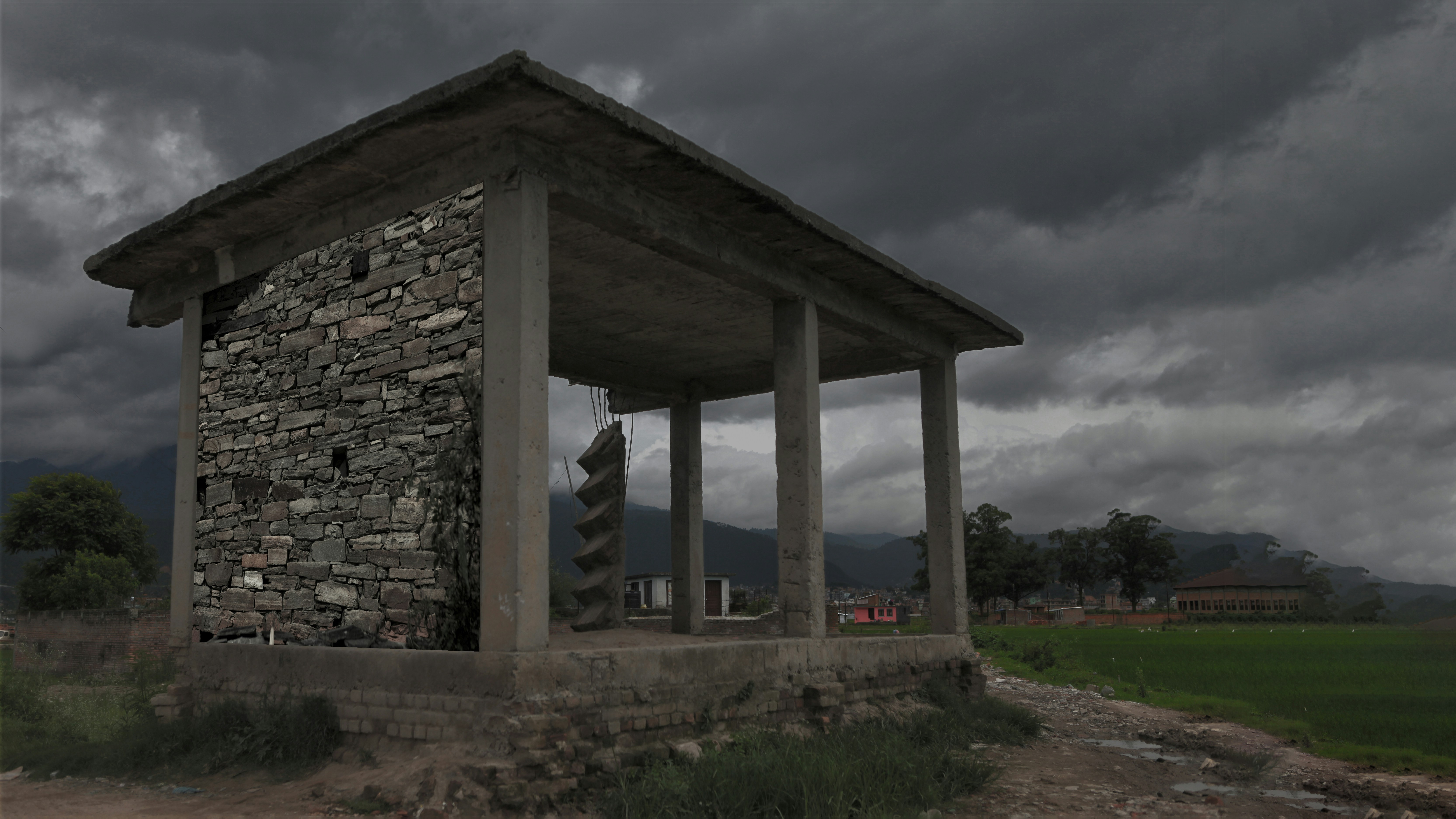 Stone Shelter on the Plain Under a Looming Sky