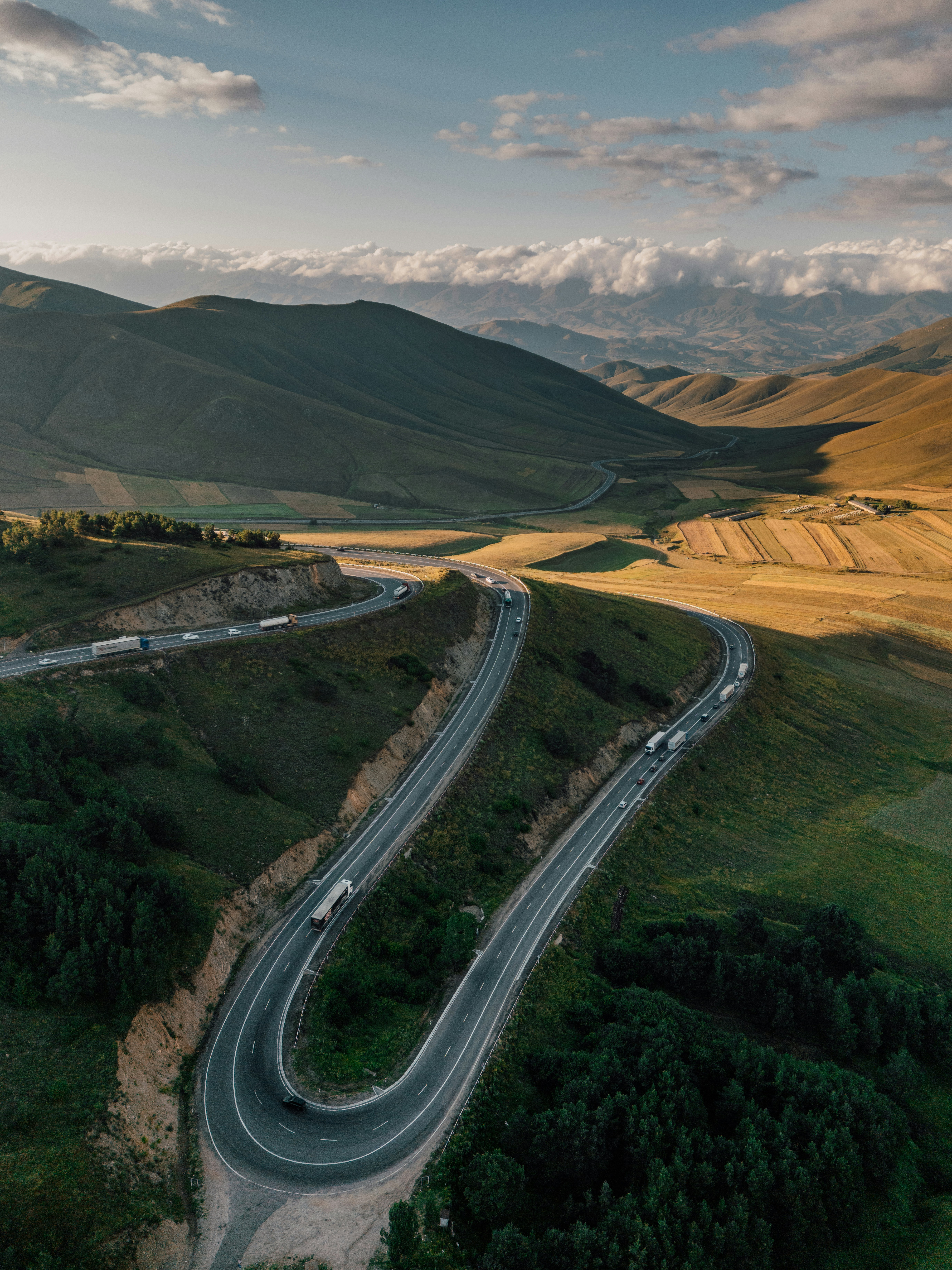 Winding Ascent: A Ribbon of Asphalt Through Golden Hills