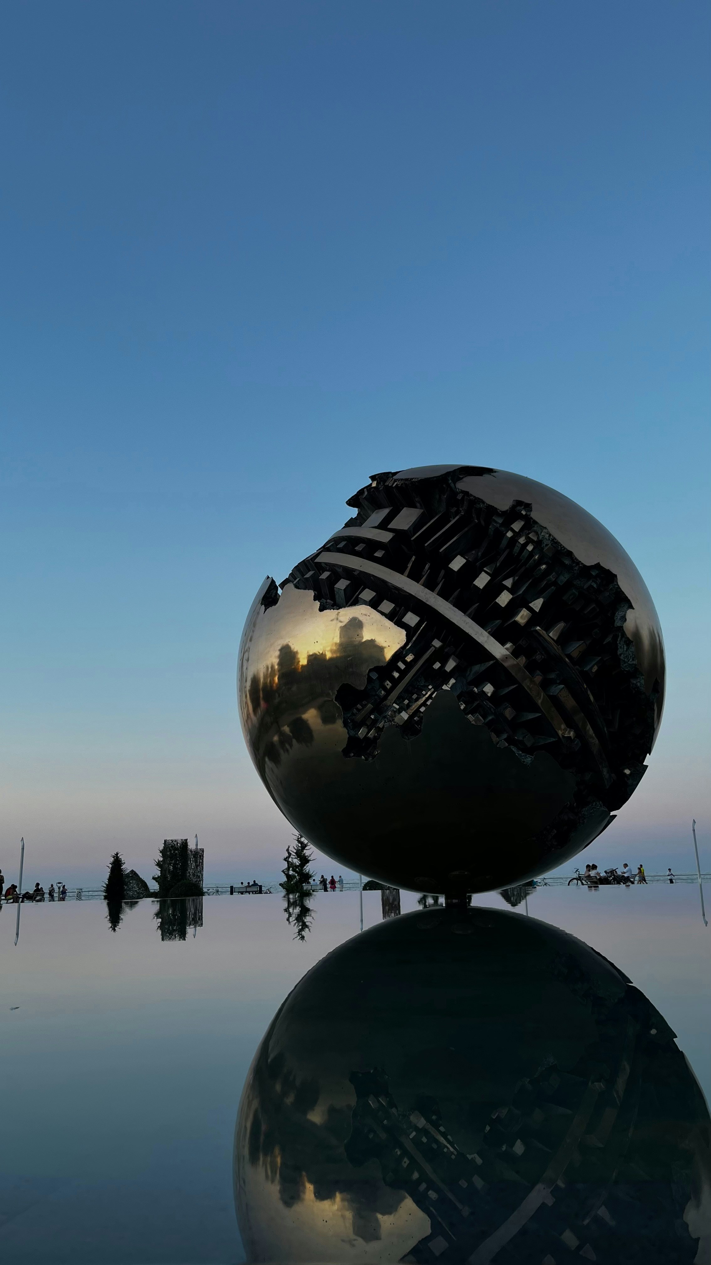 The Bean at Dusk: City Reflections on a Chrome Sphere